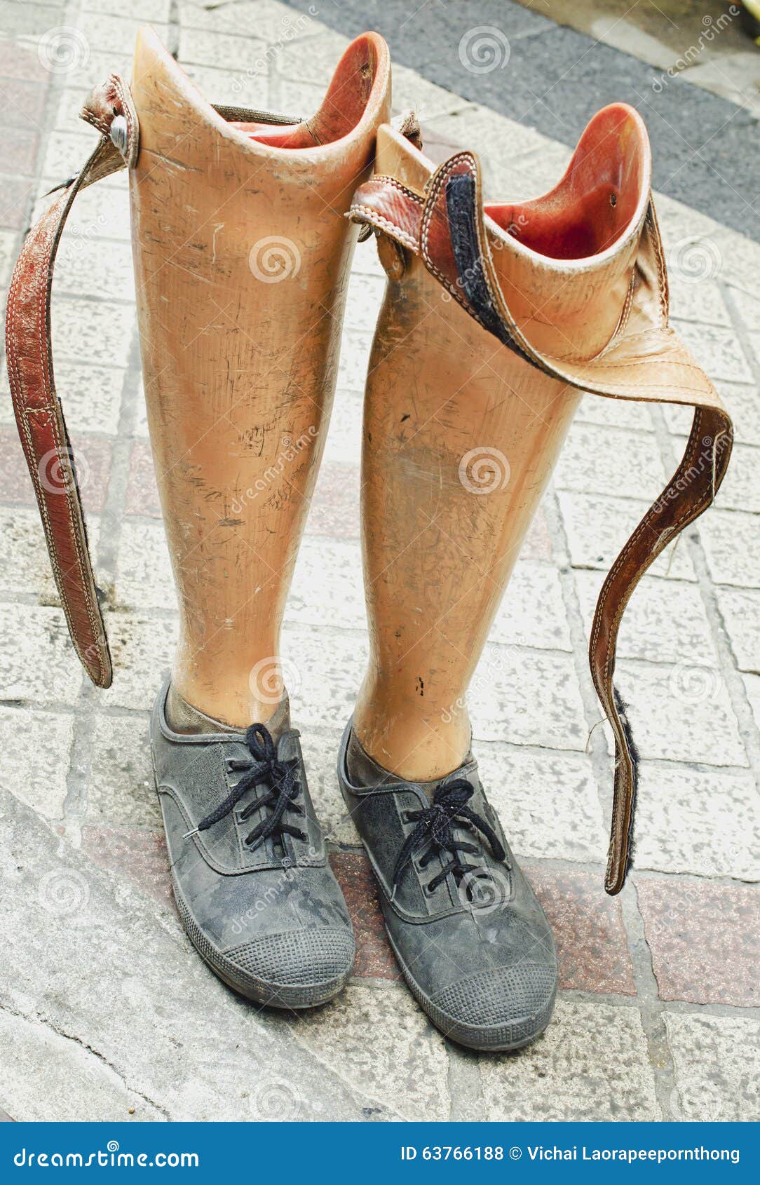 Old Prosthetic Legs Set on a Cement Floor Stock Photo - Image of foot ...