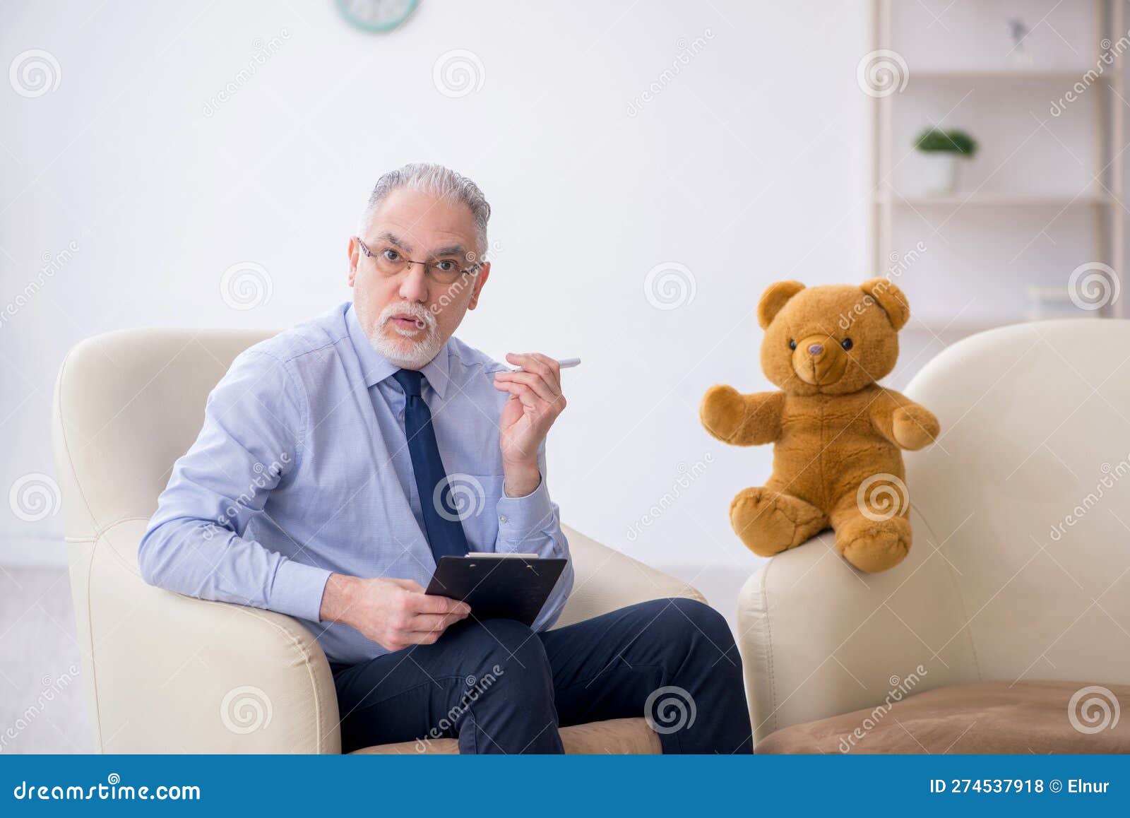 Old Male Psychologist and Soft Bear in the Room Stock Photo - Image of ...