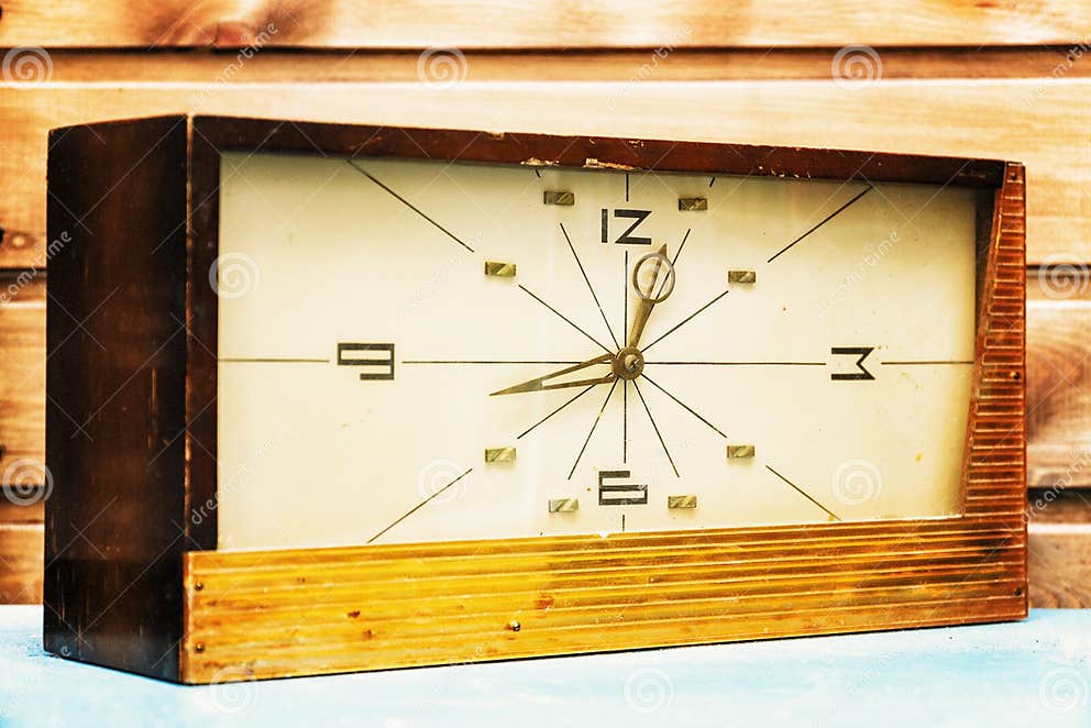 Old Rectangular Clock on the Background of Wooden Wall Stock Image ...