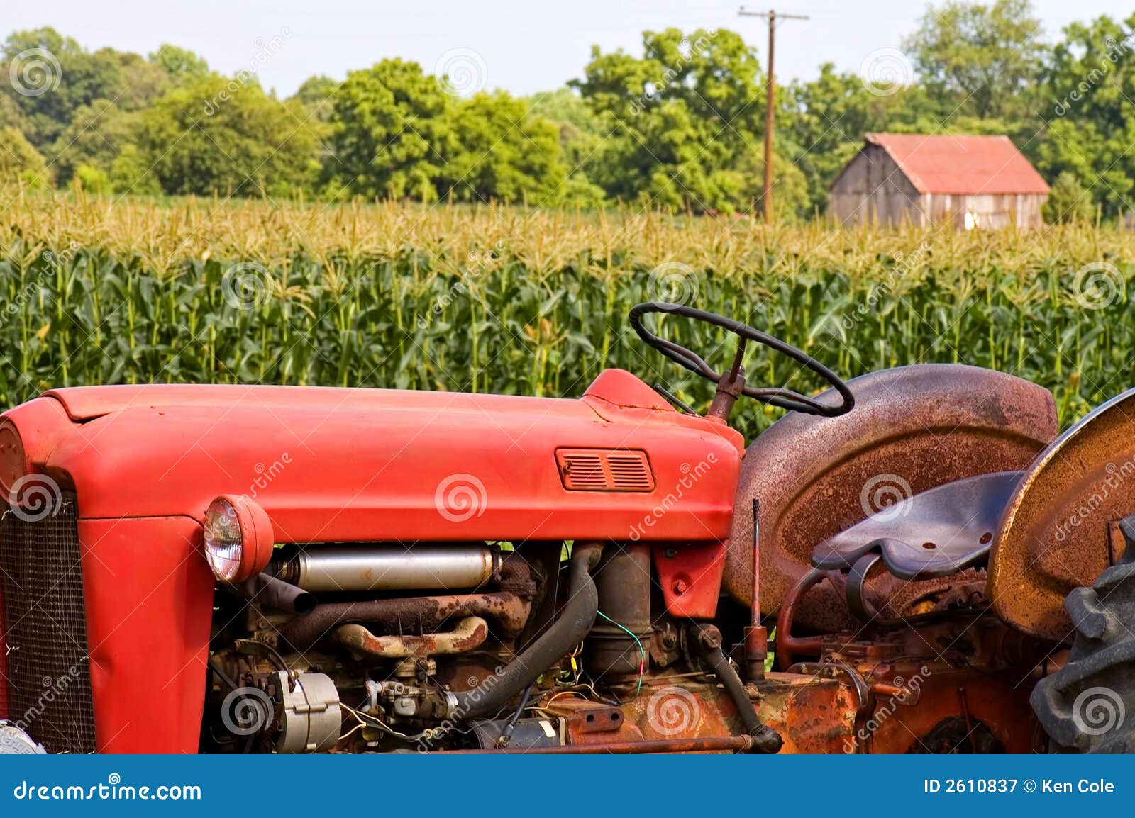 A Farm Tractor And Auger Filling A Grain Silo Royalty-Free Stock ...
