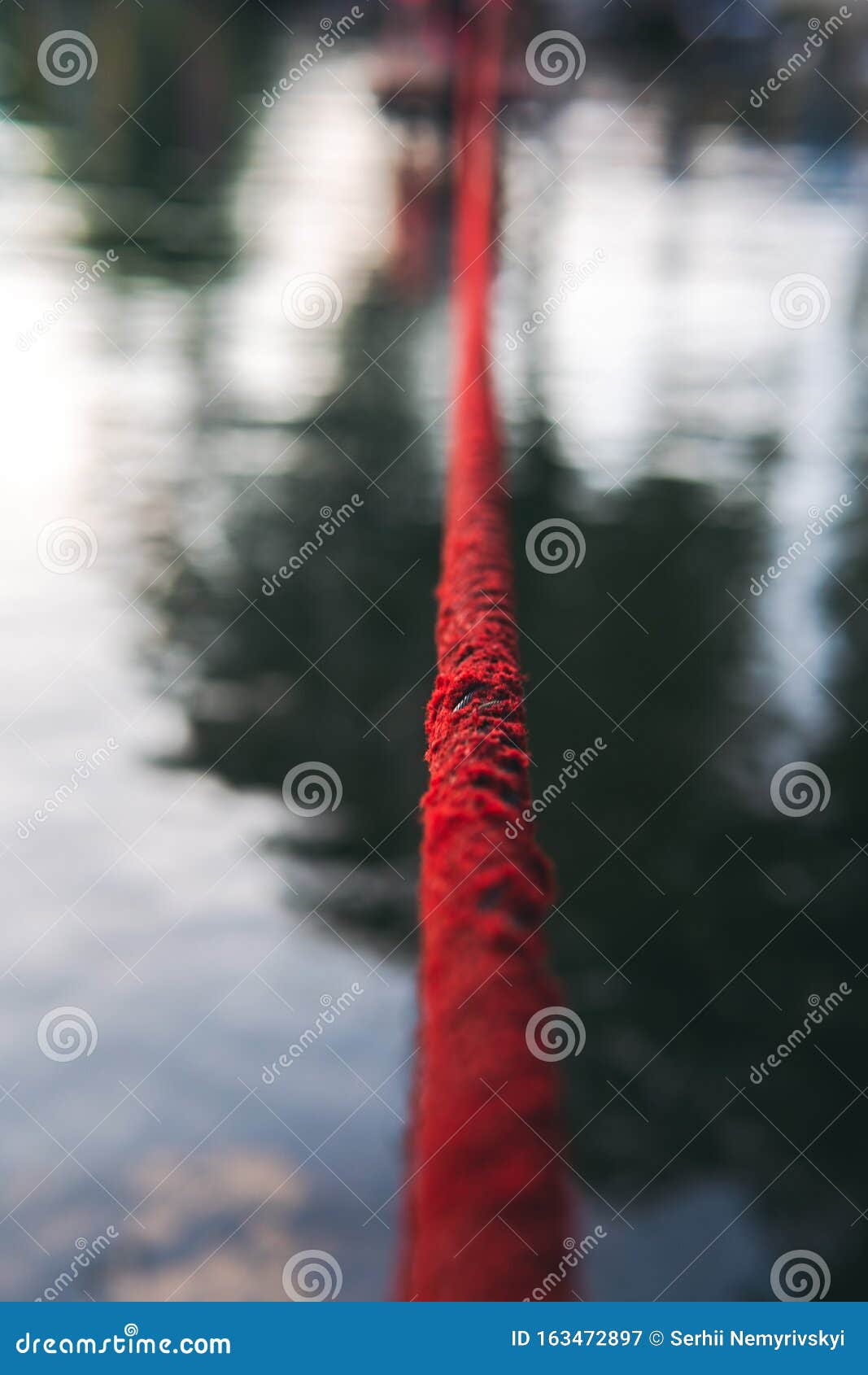 Old Red Rope Pulled Over Water, Selective Focus, Close, Details, Torn ...