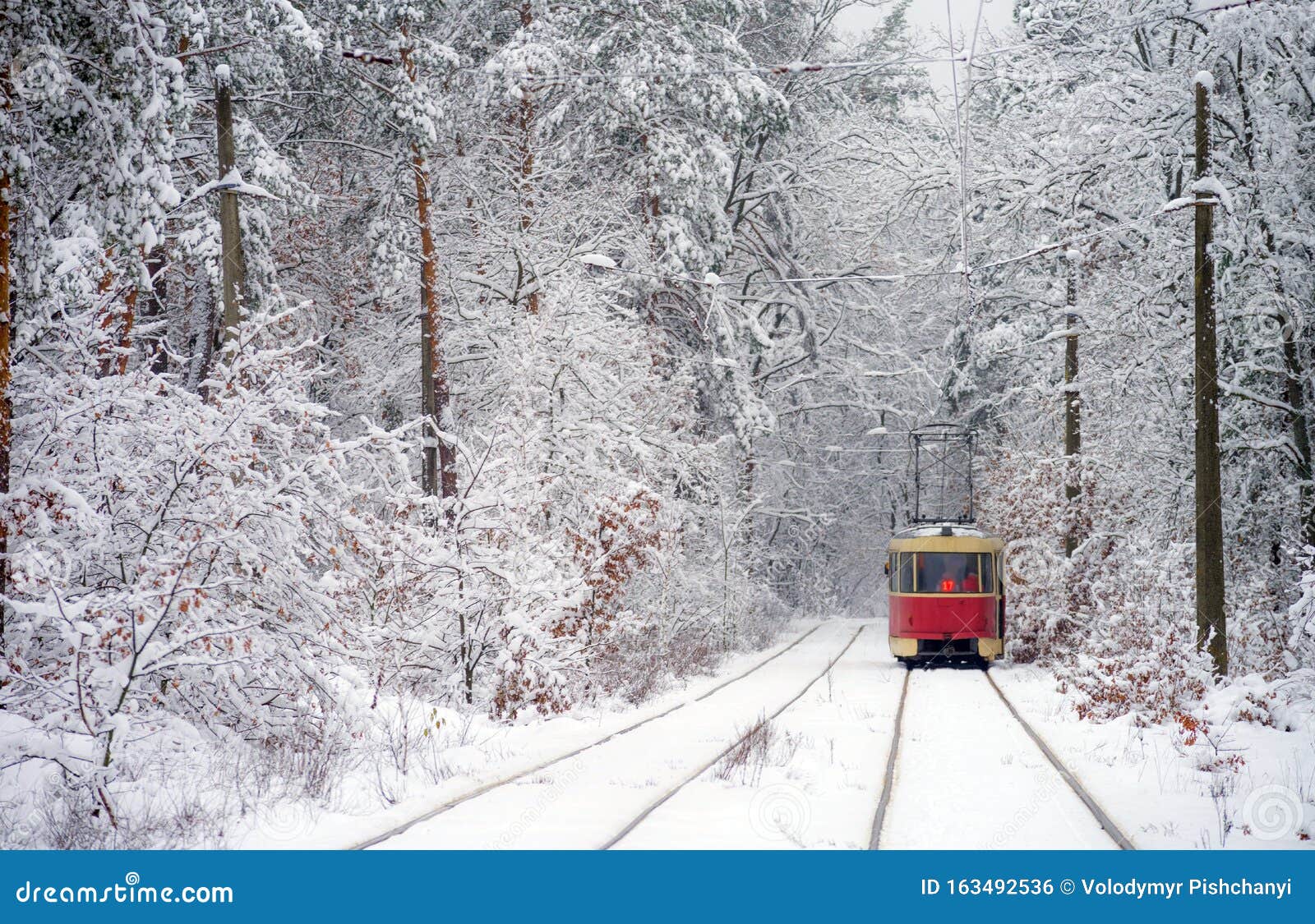 Old Red Tram, Leaving the Distance through the Snow-covered Forest ...