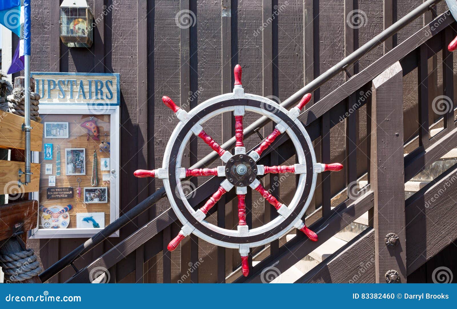 Old Red and White Ships Wheel on Wall Editorial Image - Image of ...