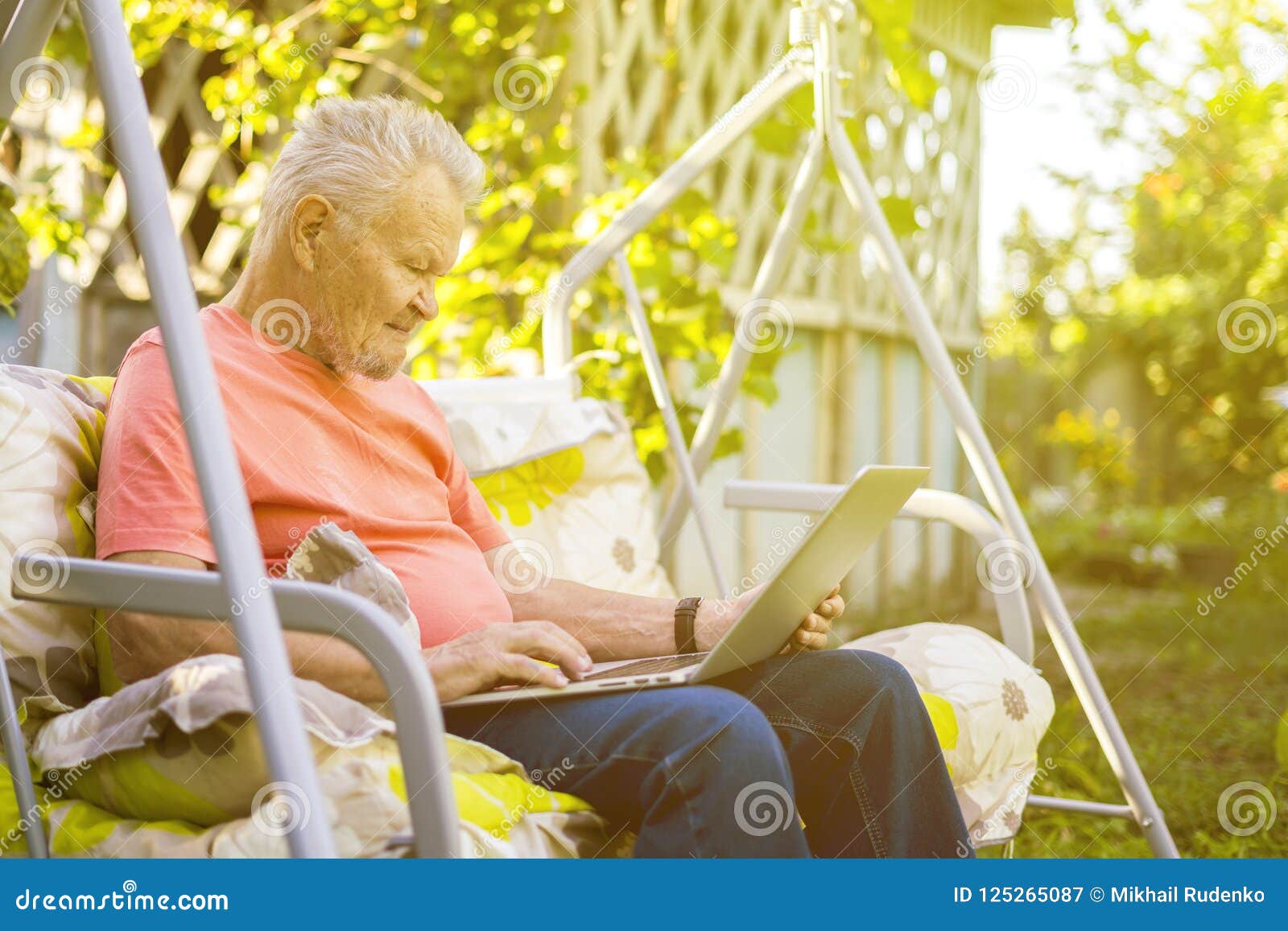 Old Retired Man Working on Computer in Summer Cottage Garden Stock ...