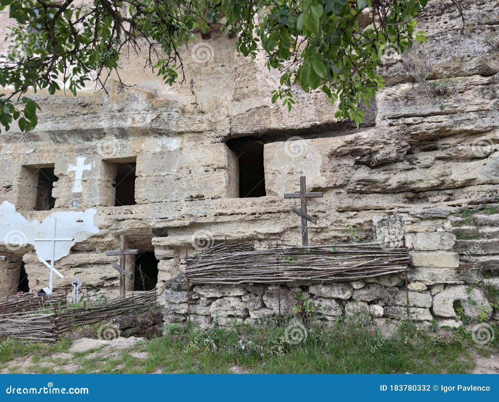 Old Rock Monastery. Empty Window Openings. Wooden Cross Stock Photo ...