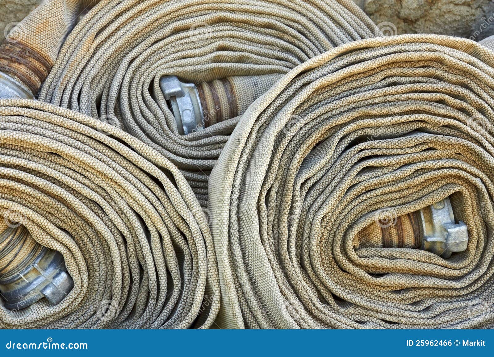 Old Rolled Fire Hoses with Nozzles Stock Photo - Image of couplings ...
