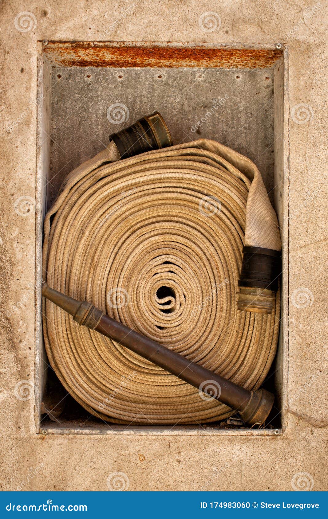 Old rolled up fire hose stock photo. Image of reel, italy - 174983060