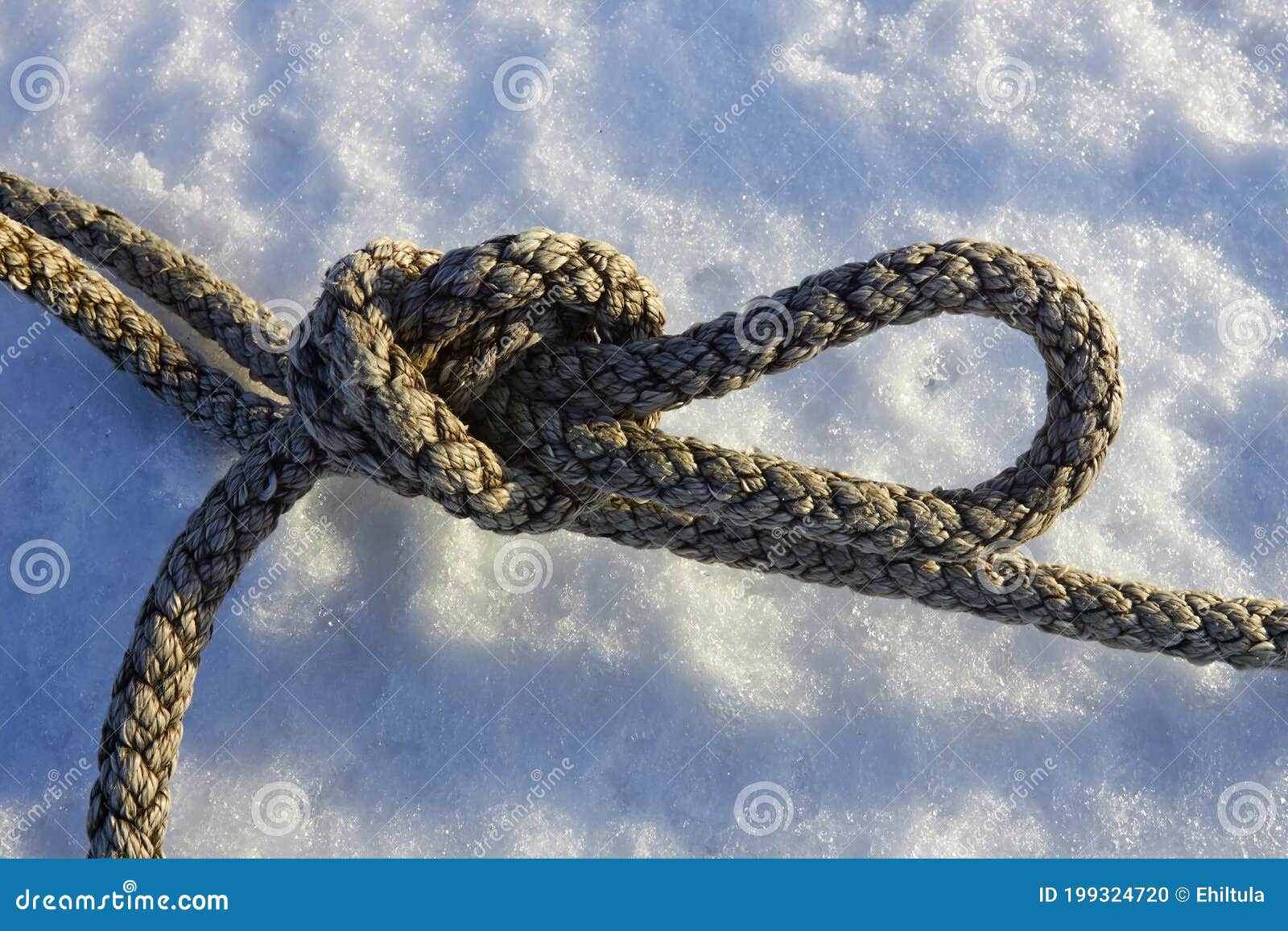 Old rope on ground stock photo. Image of knot, winter - 199324720