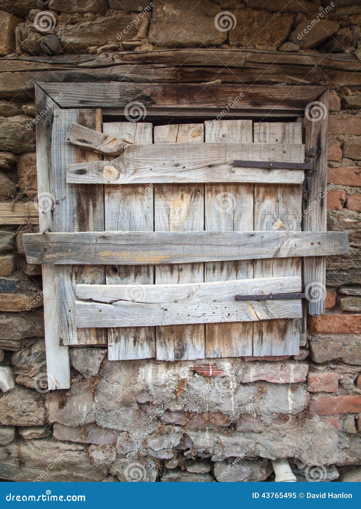 Old Rotten Hatch in a Rustic Brick Wall Stock Image - Image of grain ...