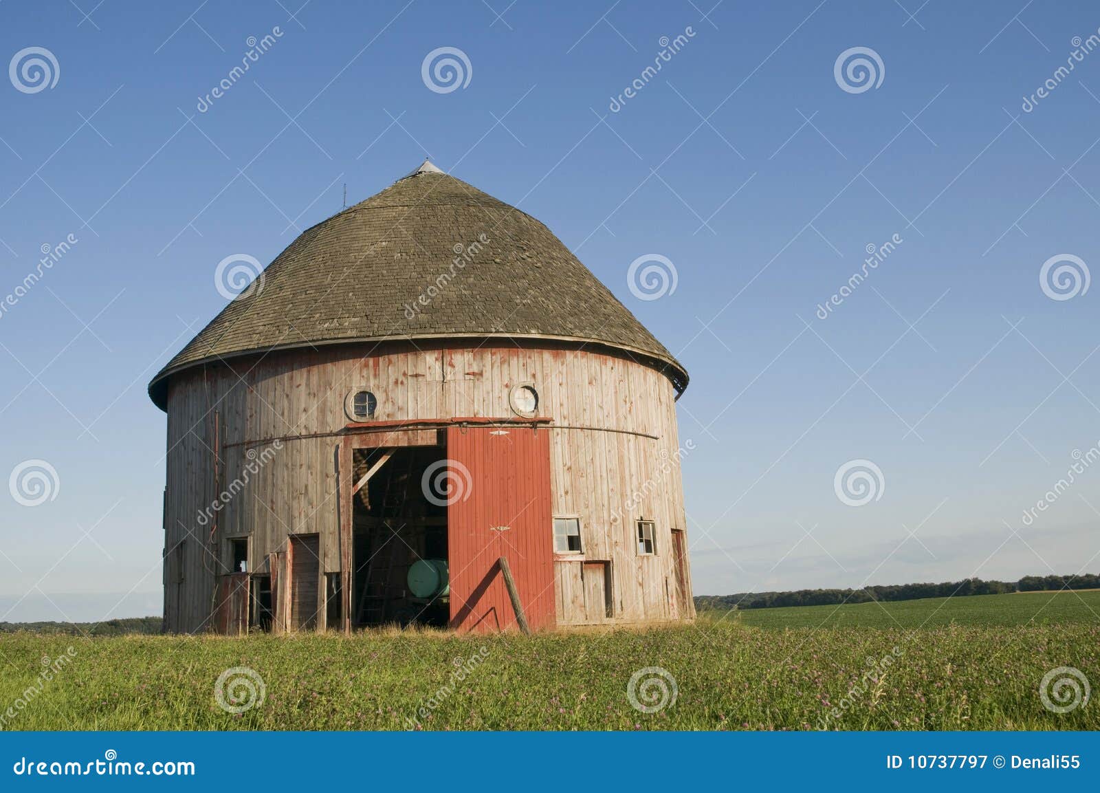 Old round barn in field stock image. Image of structure - 10737797