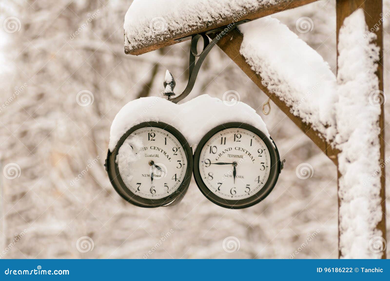 Old clock under the snow stock photo. Image of street - 96186222
