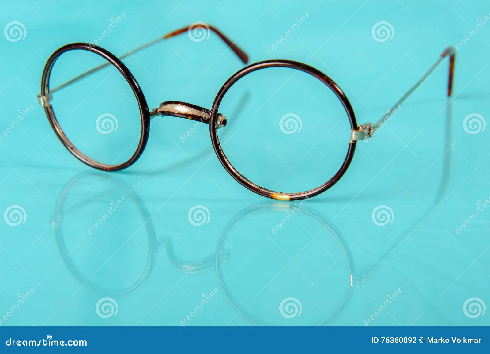 Old Round Glasses on Reflective Ground Stock Photo - Image of circle ...