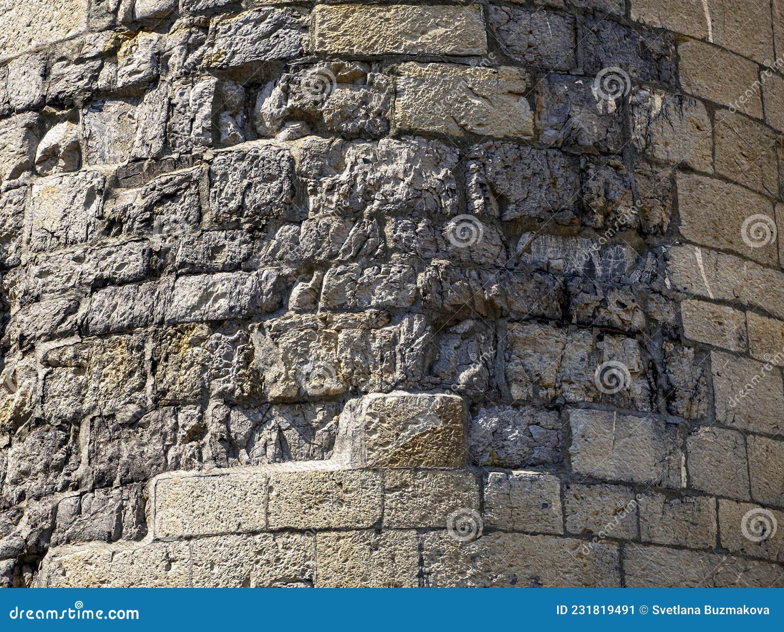 The Old Rounded Wall is Made of Rectangular Stone Blocks. the Surface ...