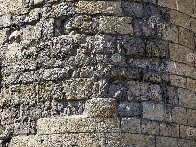The Old Rounded Wall is Made of Rectangular Stone Blocks. the Surface ...