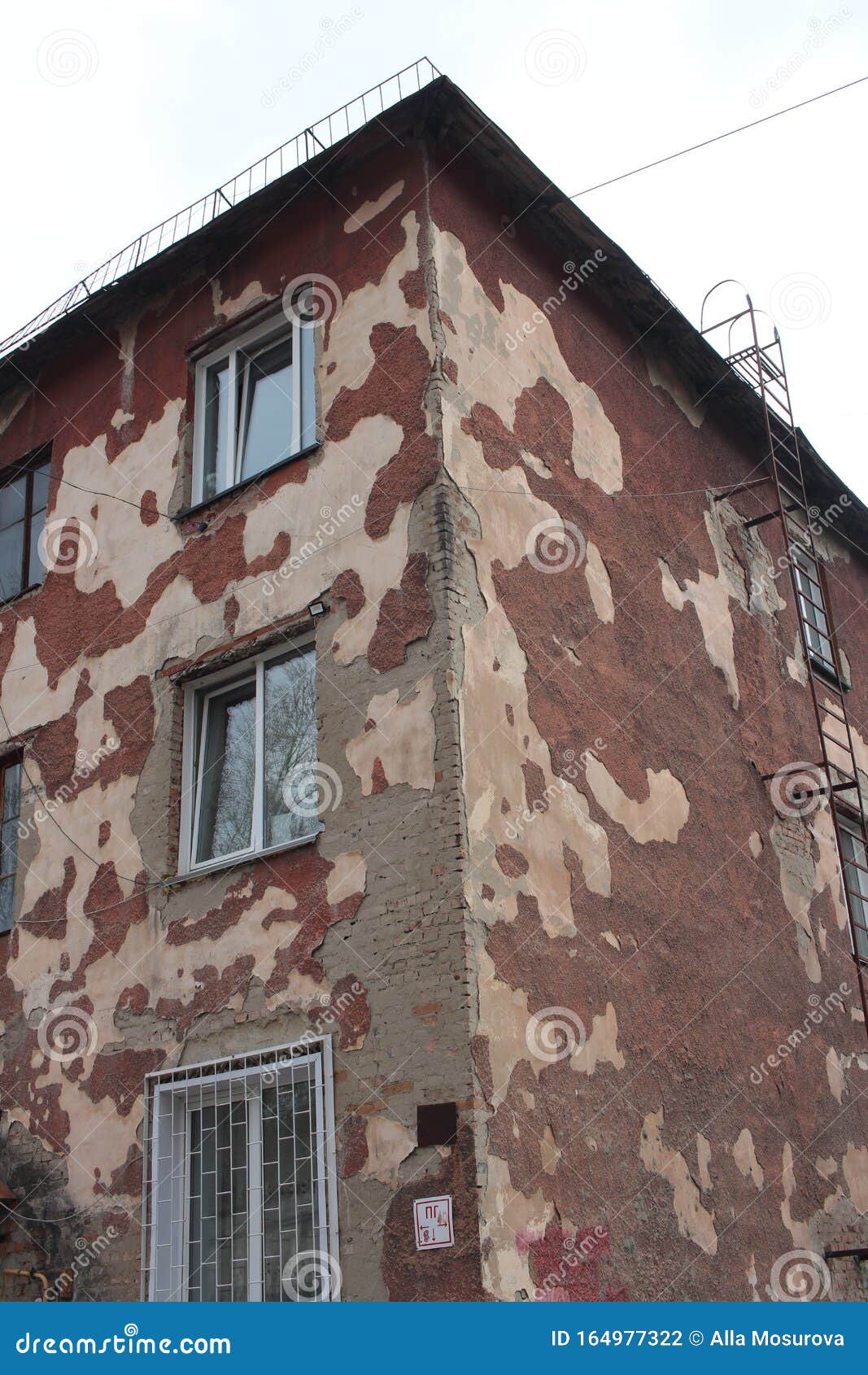 Old Ruined Building with Dirty Broken Windows on the Figured Facade is ...