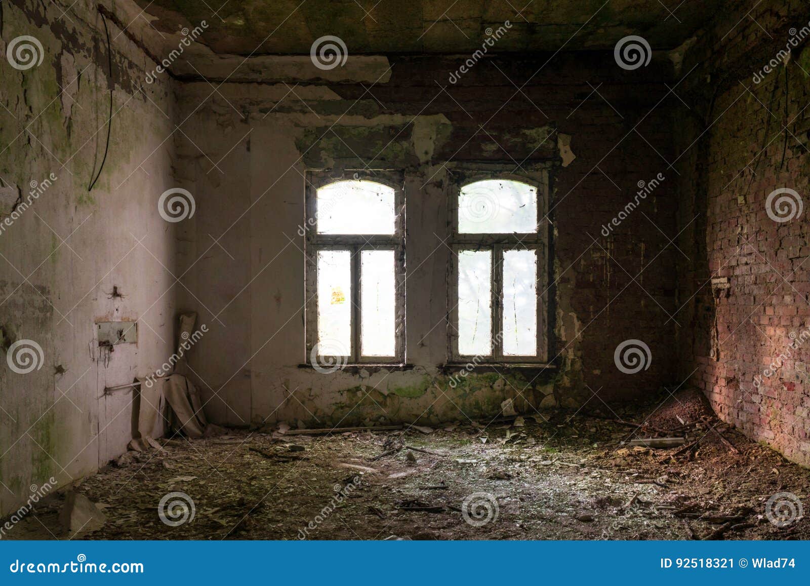 Ruined Room With Holes In Wall, Ceiling And Broken Windows In A Loft ...