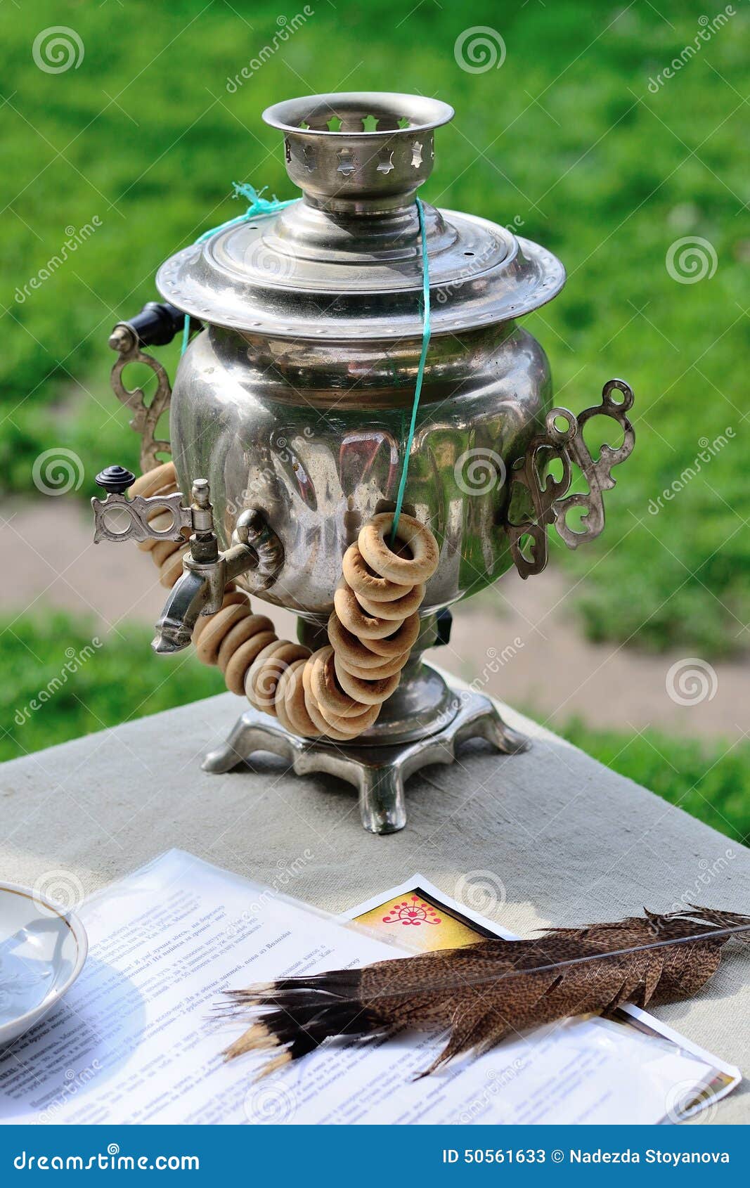 Old Russian Tea Samovar with a Bunch of Bagels and Goose Quill. Stock ...