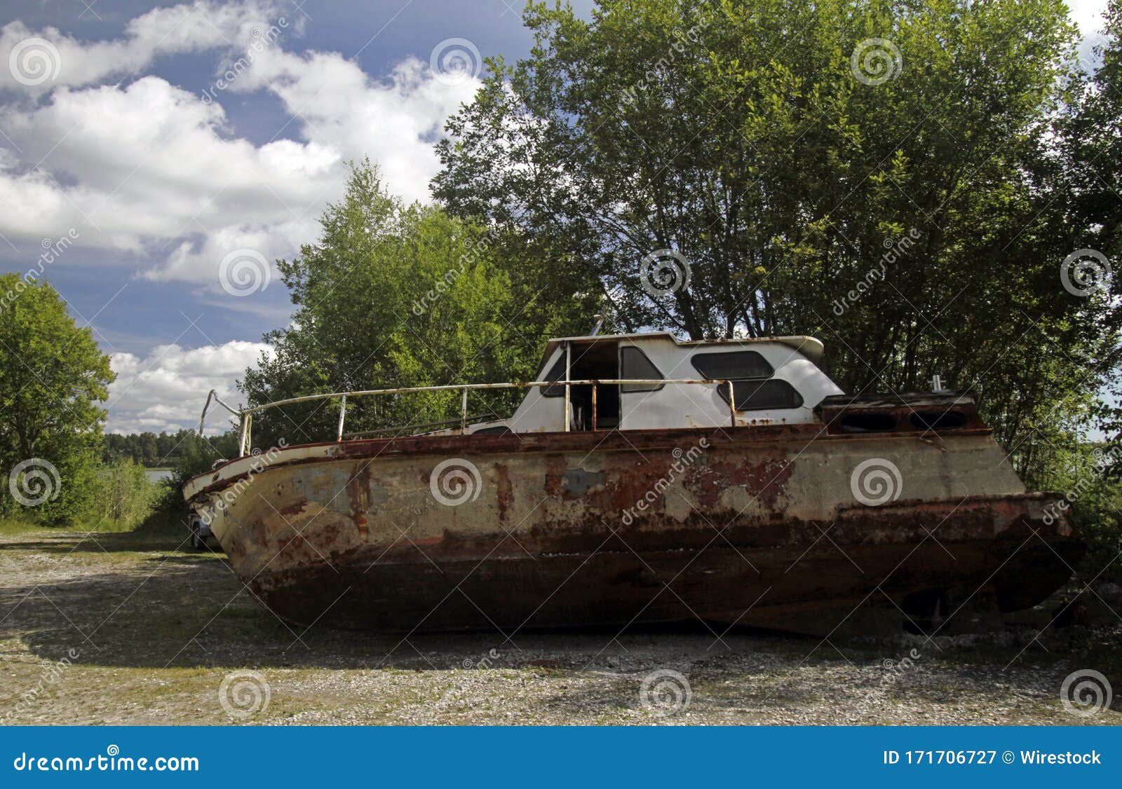 Old Rusted Boat on the Shore Near Trees Stock Image - Image of eaten ...