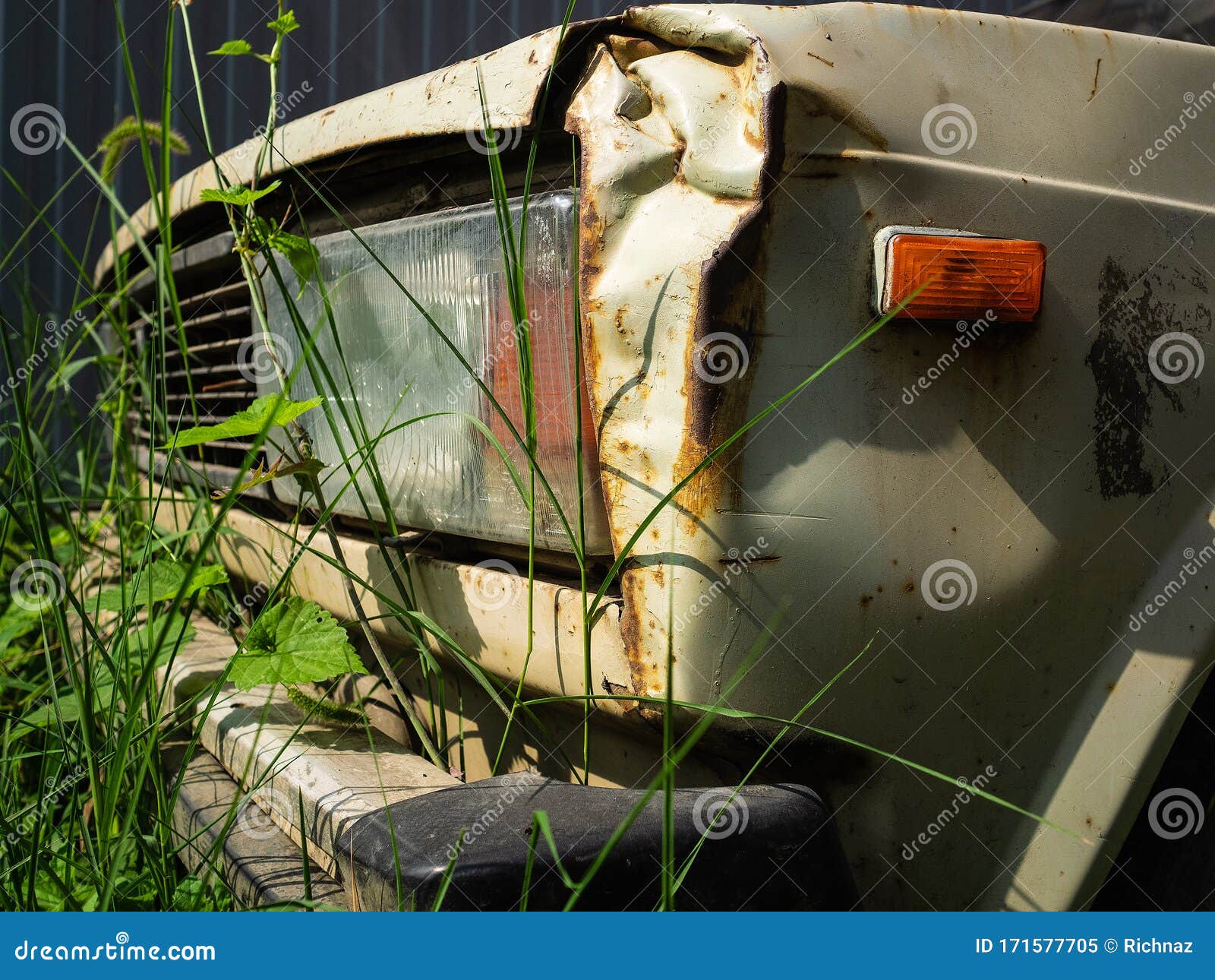 Old Rusted Car. Broken Car in the Green Grass Stock Image - Image of ...
