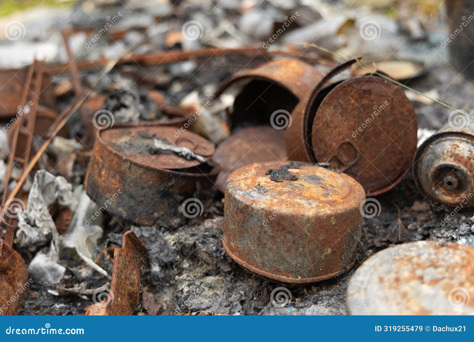 Old, Rusted Metal Cans in Burned Ash. Trash in Abandoned Army Base ...