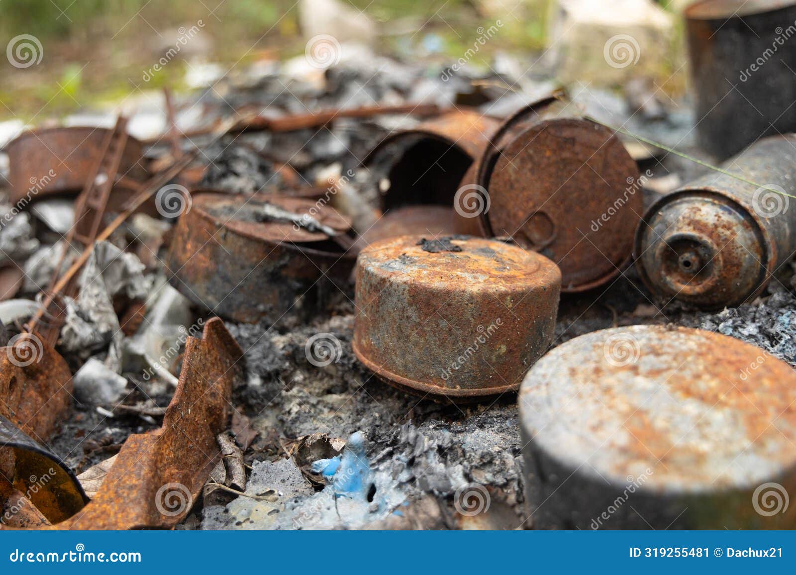Old, Rusted Metal Cans in Burned Ash. Trash in Abandoned Army Base ...