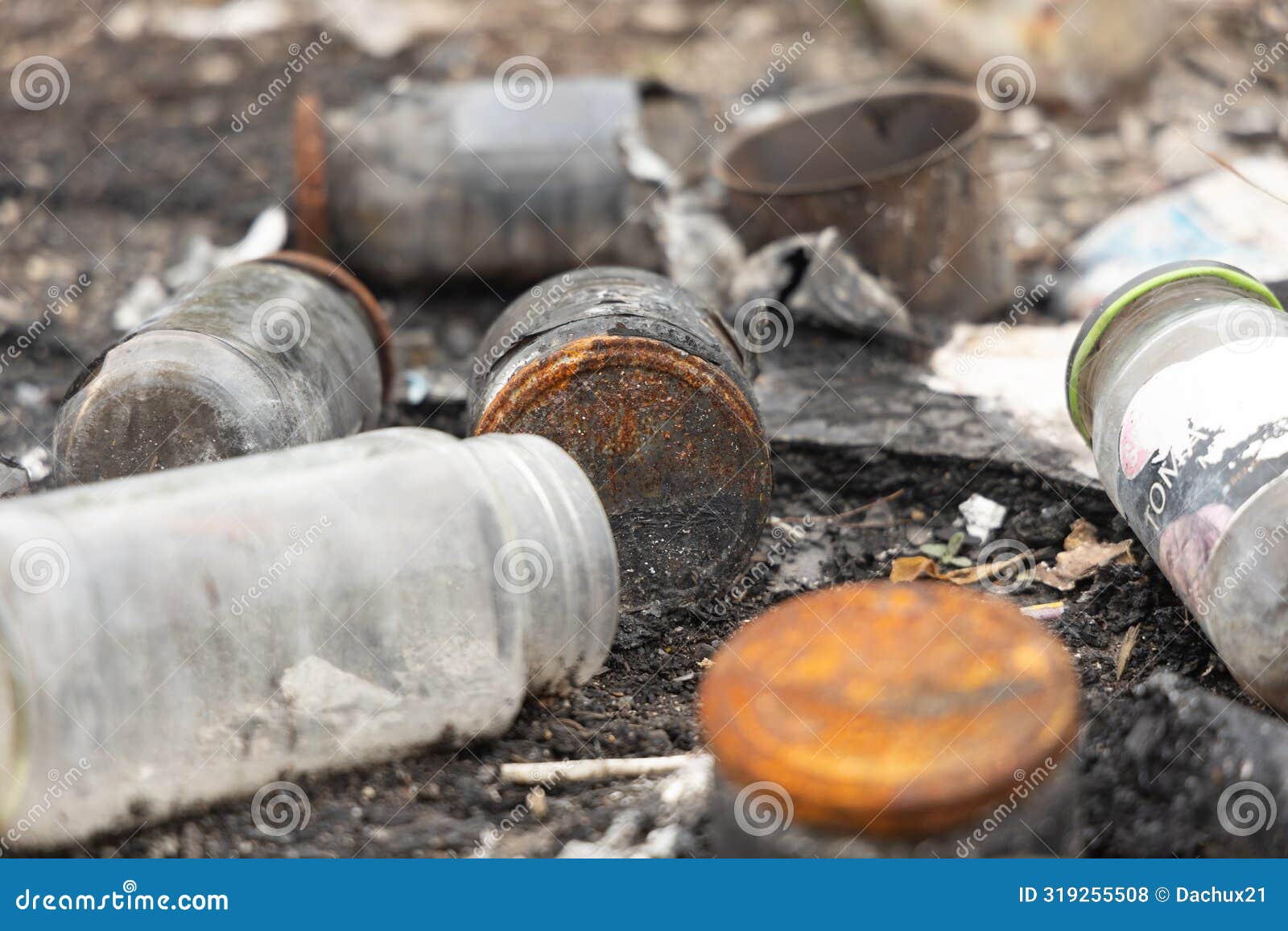 Old, Rusted Metal Cans in Burned Ash. Trash in Abandoned Army Base ...
