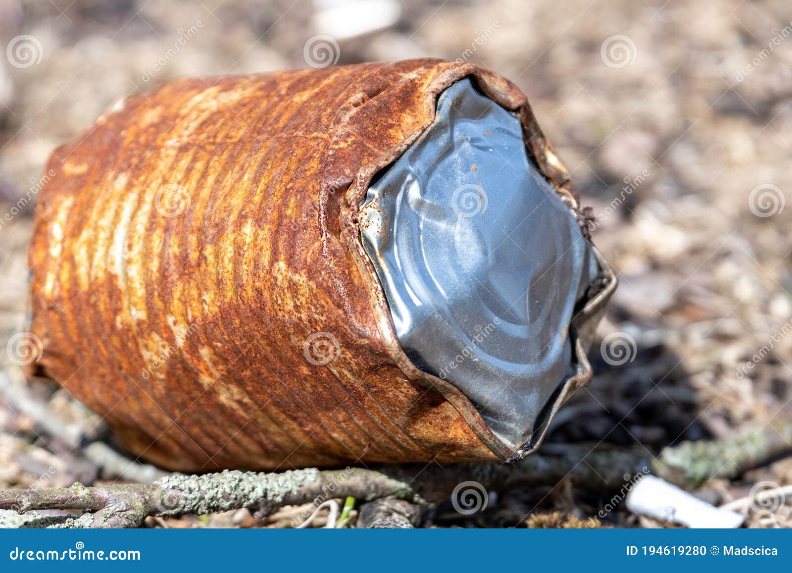 An Old, Rusted Tin Can Lying on the Ground Stock Photo - Image of ...