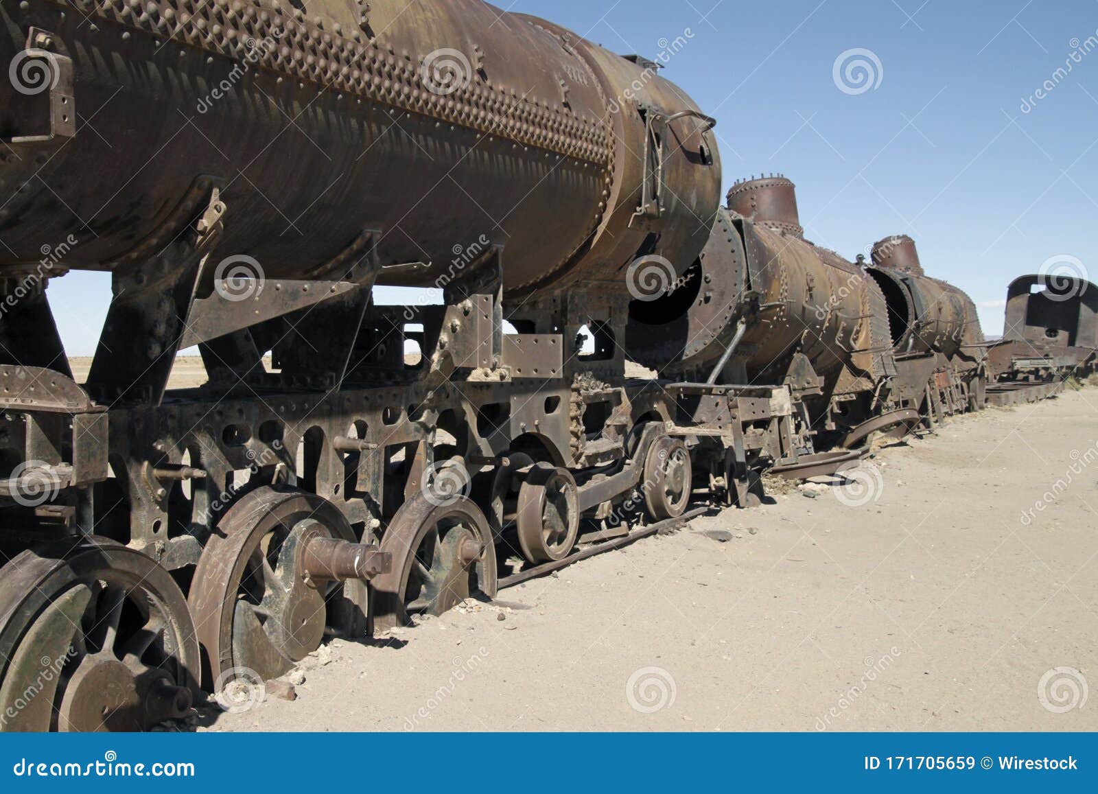 Old Rusted Train on the Tracks Under a Blue Sky Stock Image - Image of ...