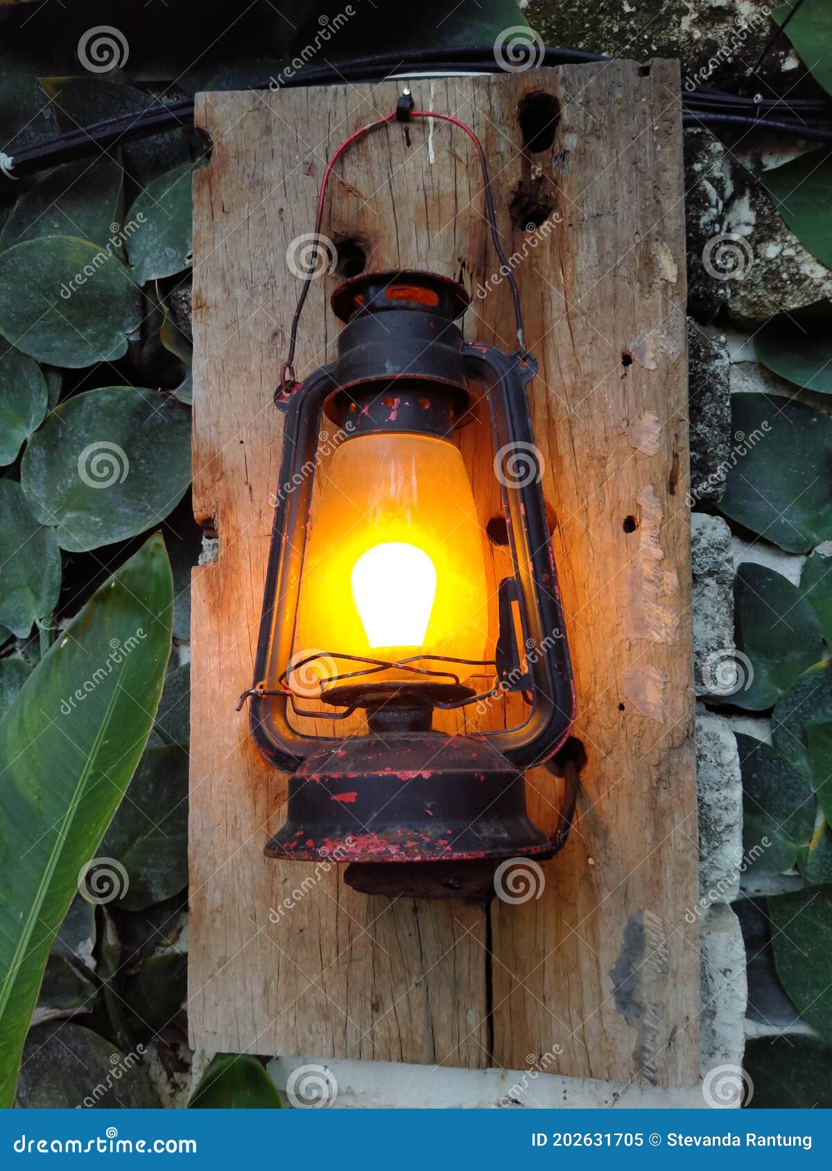 Old Rustic Lantern on the Wall Stock Image - Image of yellow, rustic ...