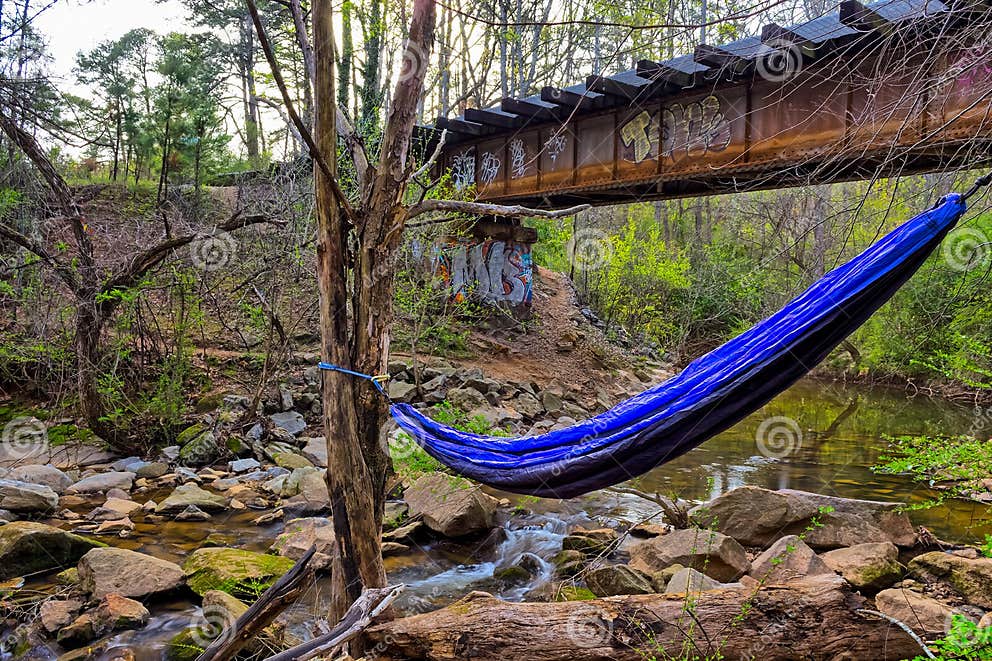 Old Rustic Rail Road Bridge with Hammock and River Stock Image - Image ...