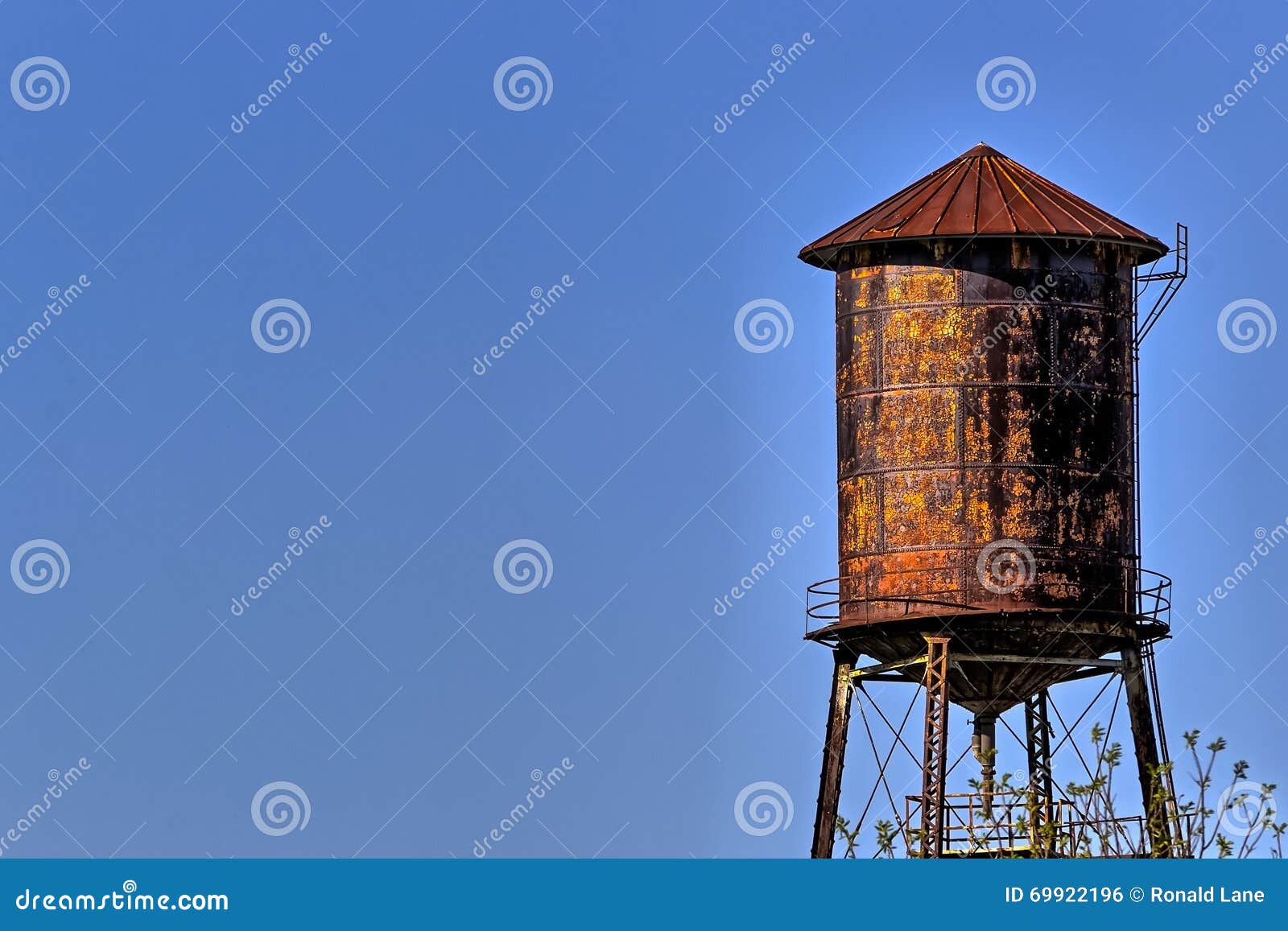 Old, Rustic Water Tower with Blue Sky Background Stock Photo - Image of ...