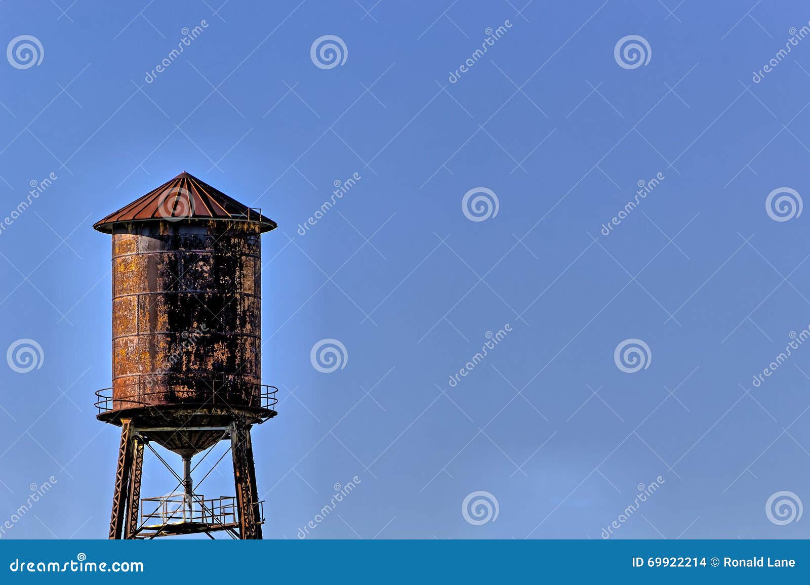 Old, Rustic Water Tower with Blue Sky Background Stock Photo - Image of ...