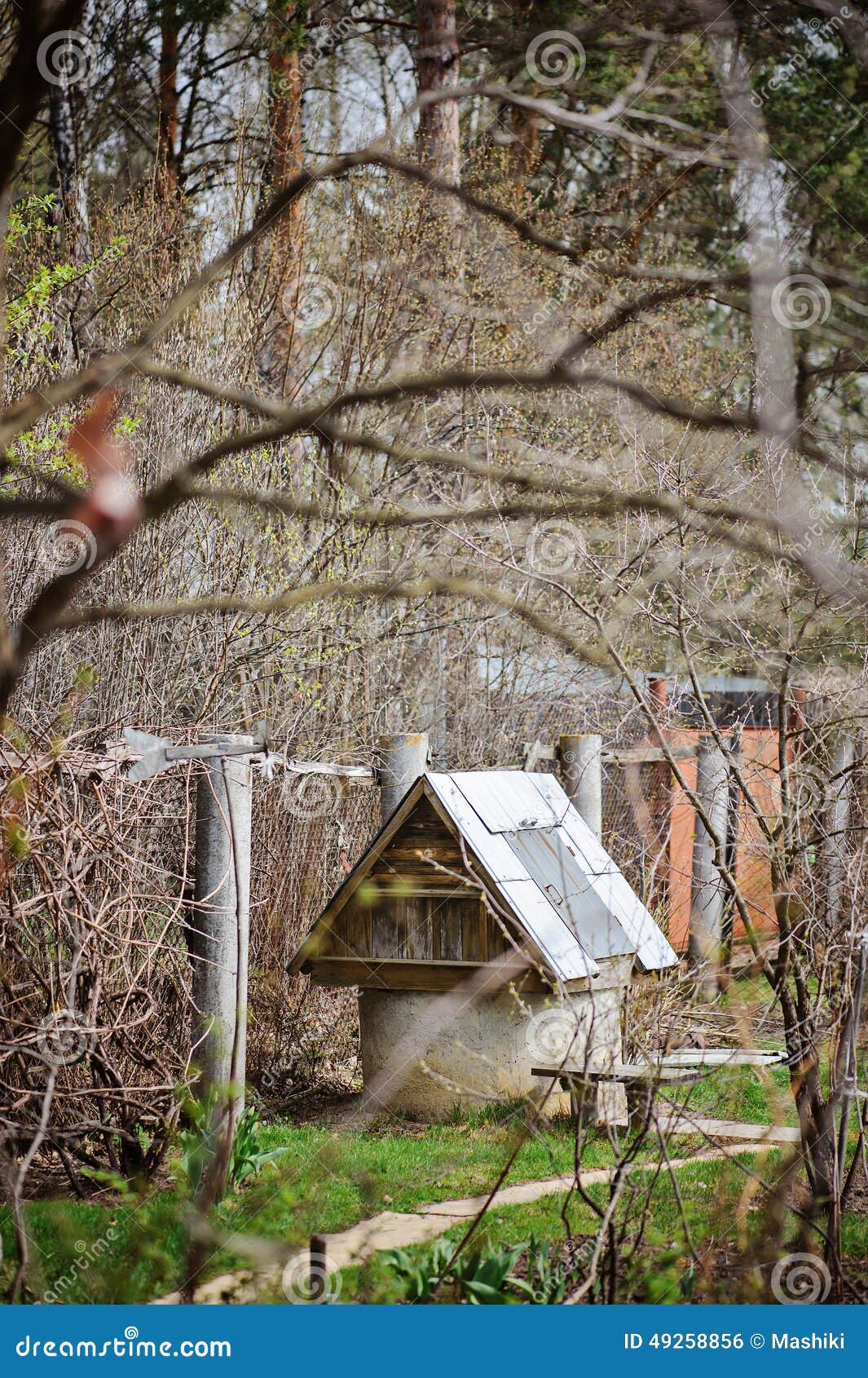 Old Rustic Water Well in Spring Garden Stock Photo - Image of drink ...