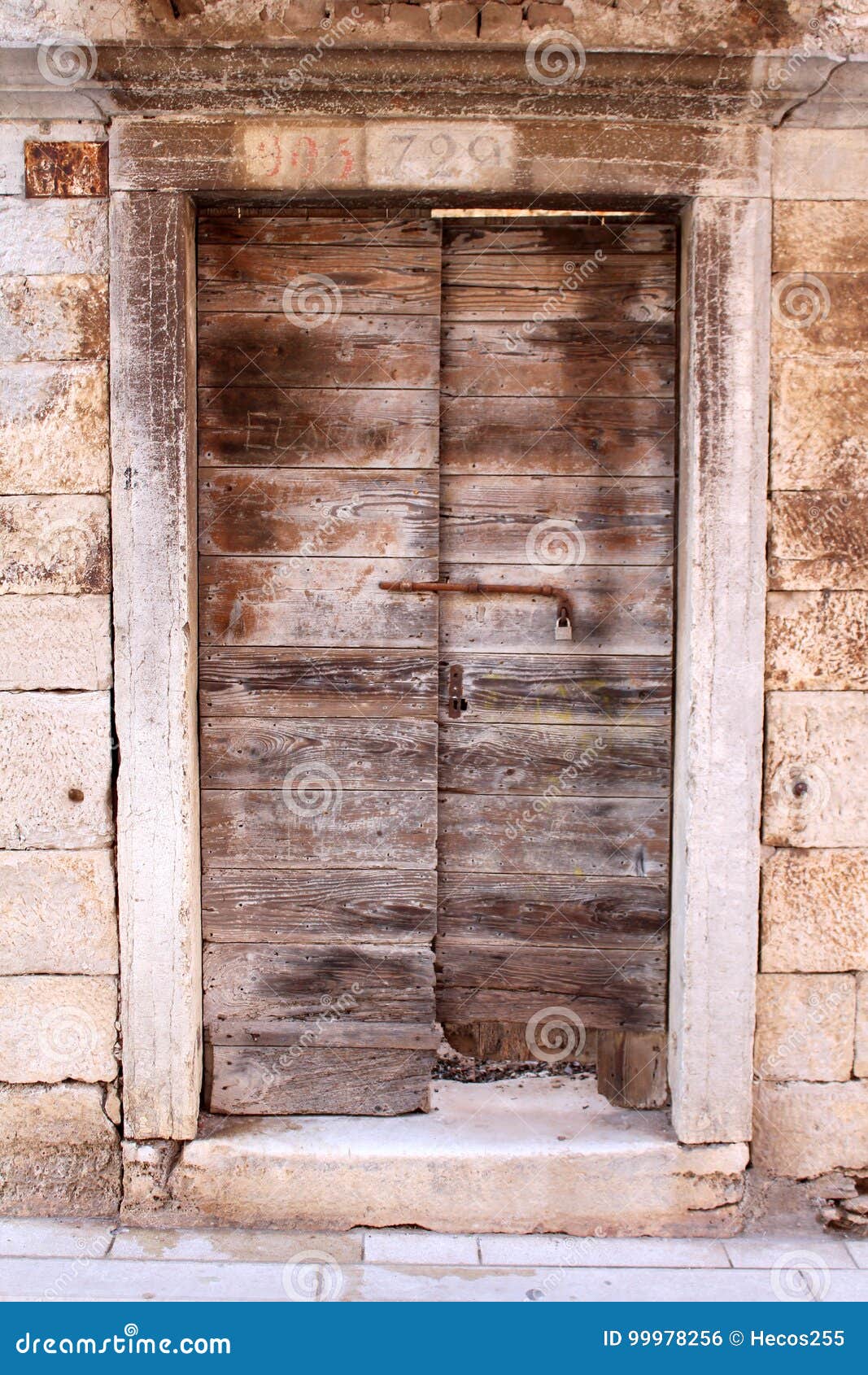Old Rustic Wooden Doors with Stone Frame Stock Photo - Image of frame ...