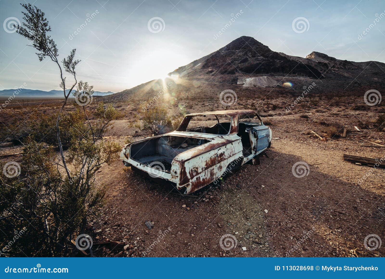 Old Rusty Abandoned Car in the Desert at Sunset Time. Stock Photo ...