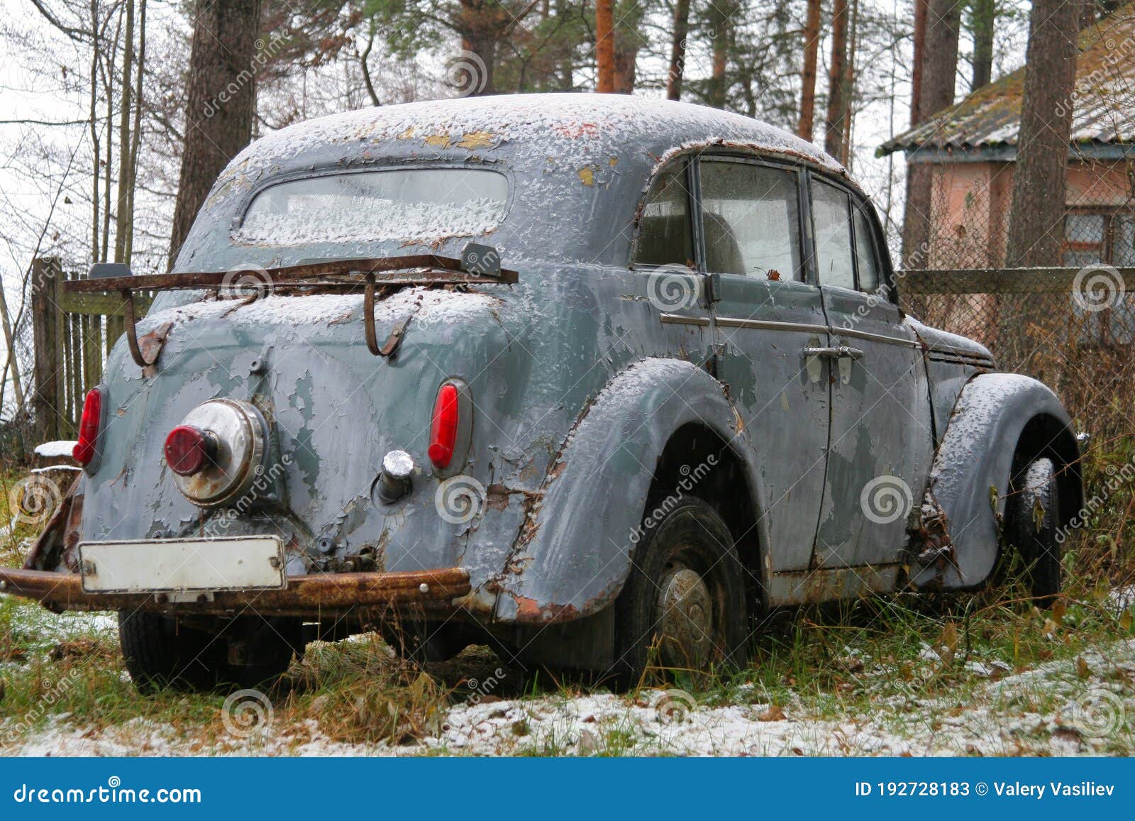 Old Rusty Abandoned Car in the Forest. Lost Old Russian Auto Stock ...