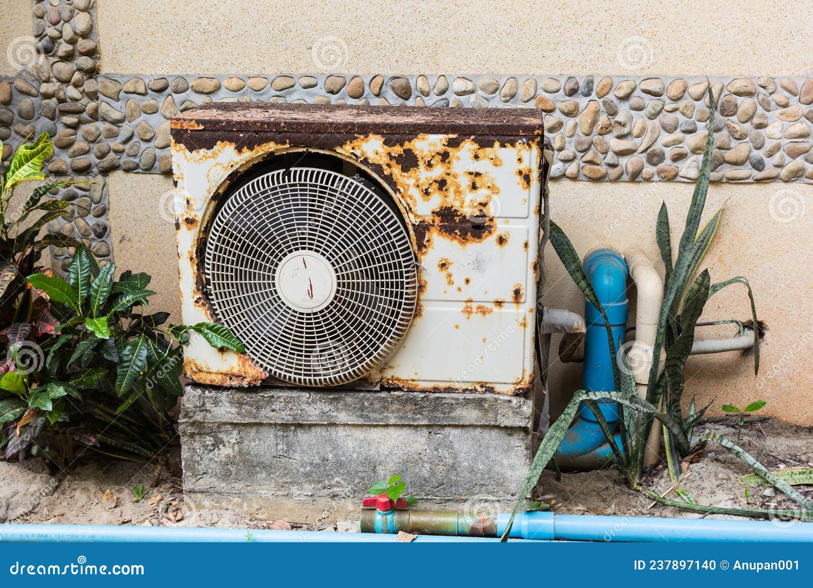Old Rusty Air Conditioner is Located Behind the Building Stock Photo ...