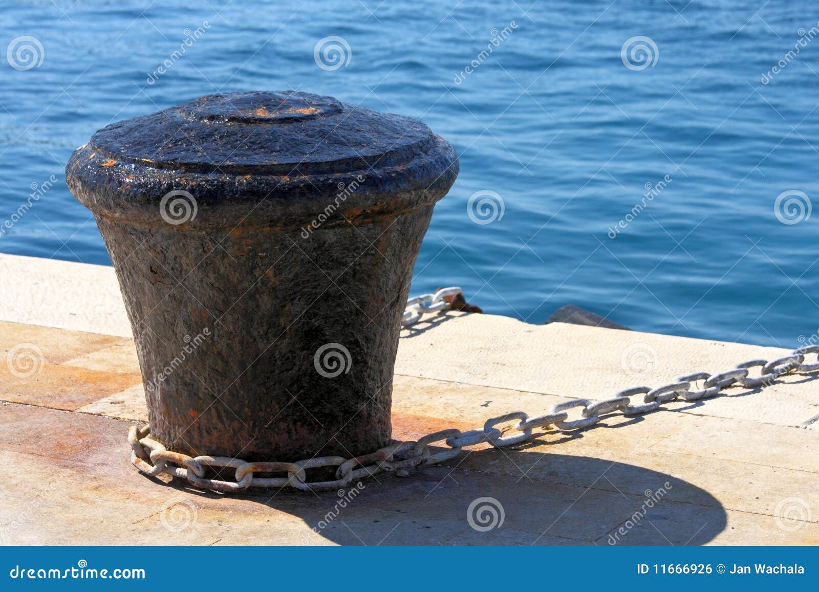 Rusty Anchor Hanging On Fence Stock Photo | CartoonDealer.com #97757664