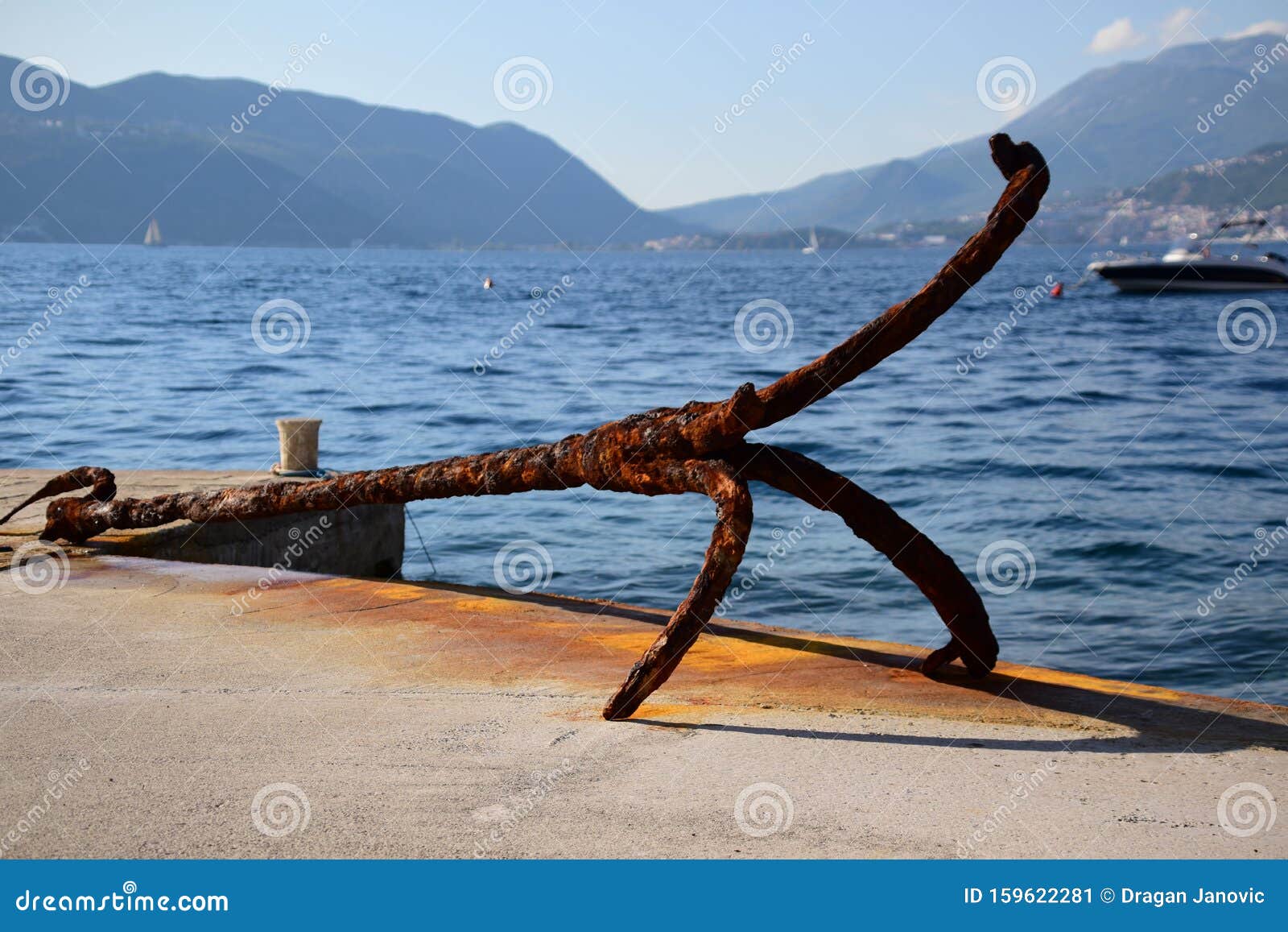 Old rusty anchor ashore stock image. Image of left, quay - 159622281