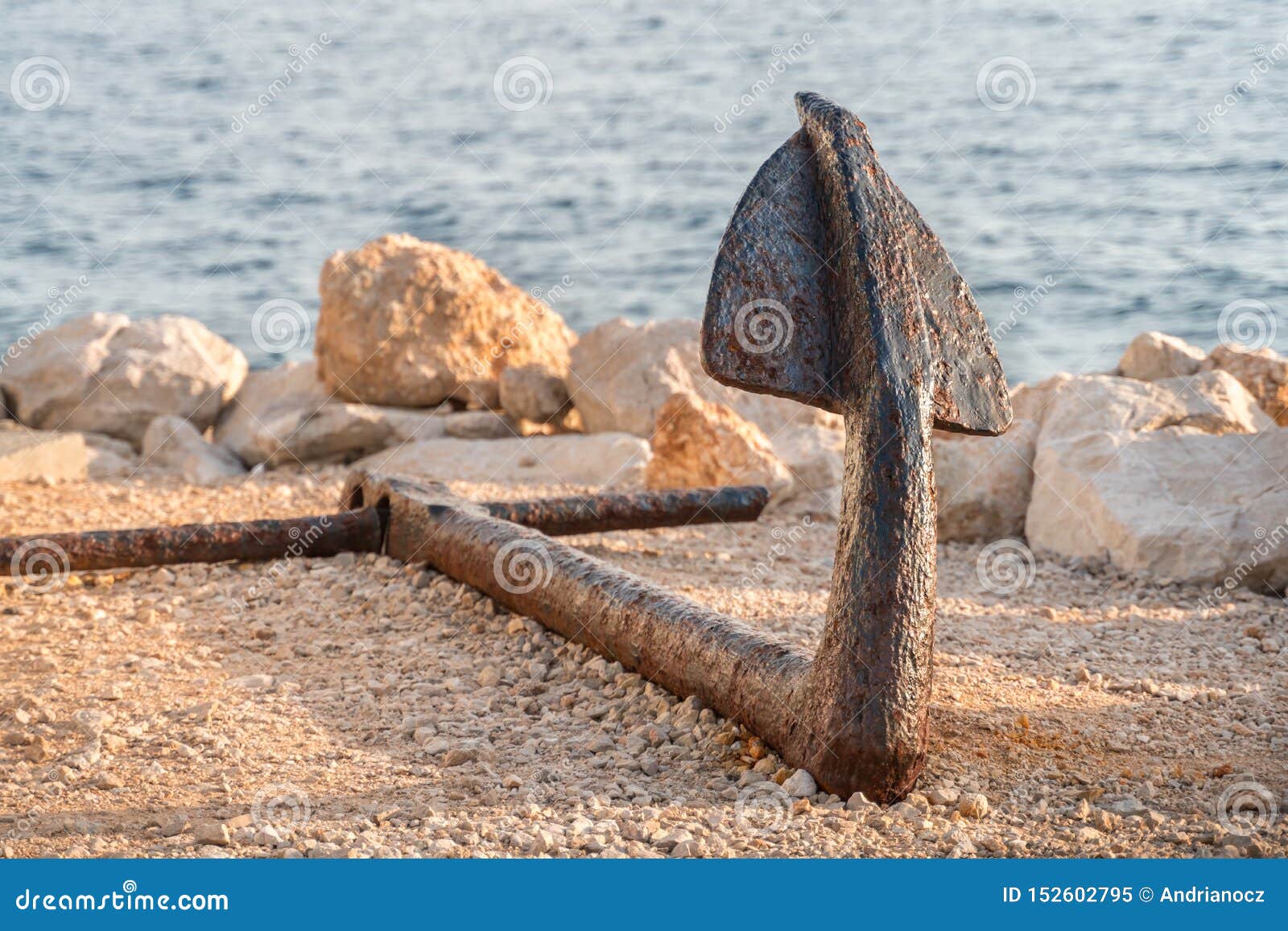 Old Rusty Anchor on the Beach with Stones Stock Image - Image of beach ...