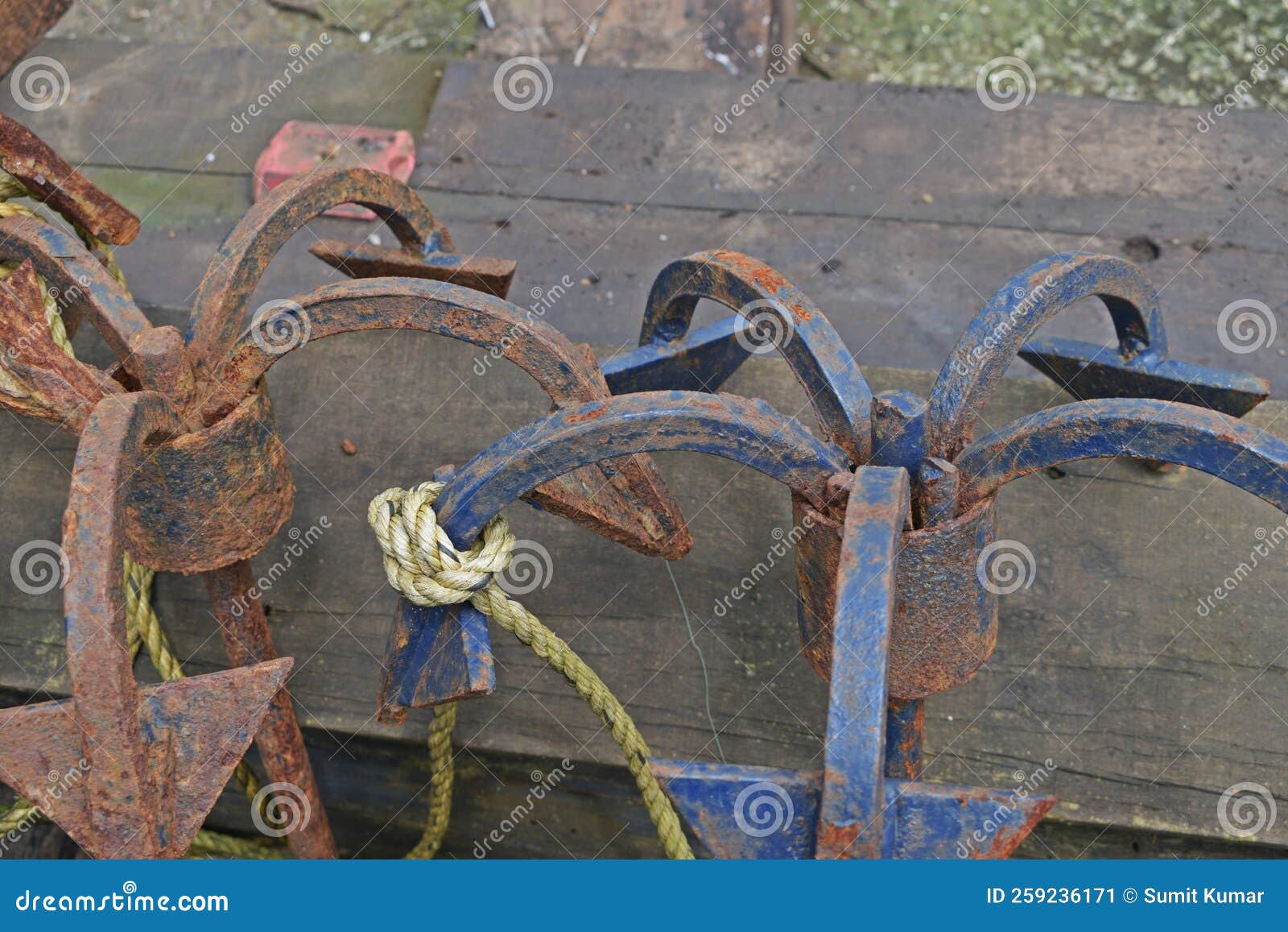 Old rustic anchor on boat stock image. Image of iron - 259236171