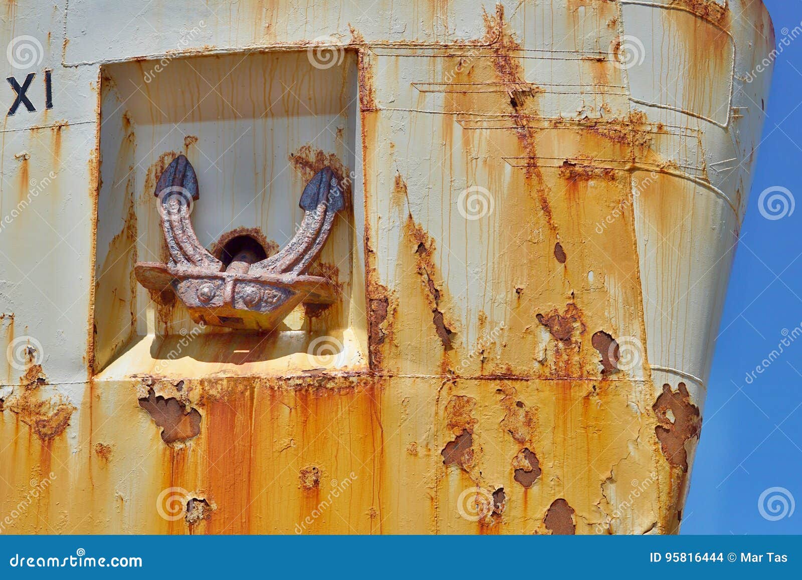 Old Rusty Anchor on the Side of and Old Metal Shipwreck in the Dock ...