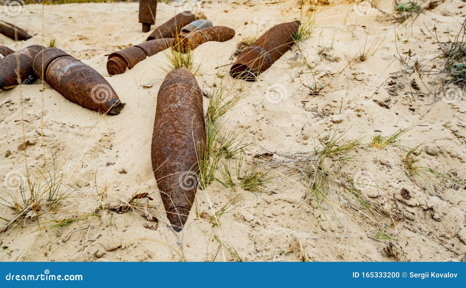 Old bombs in desert stock photo. Image of ammunition - 165333200