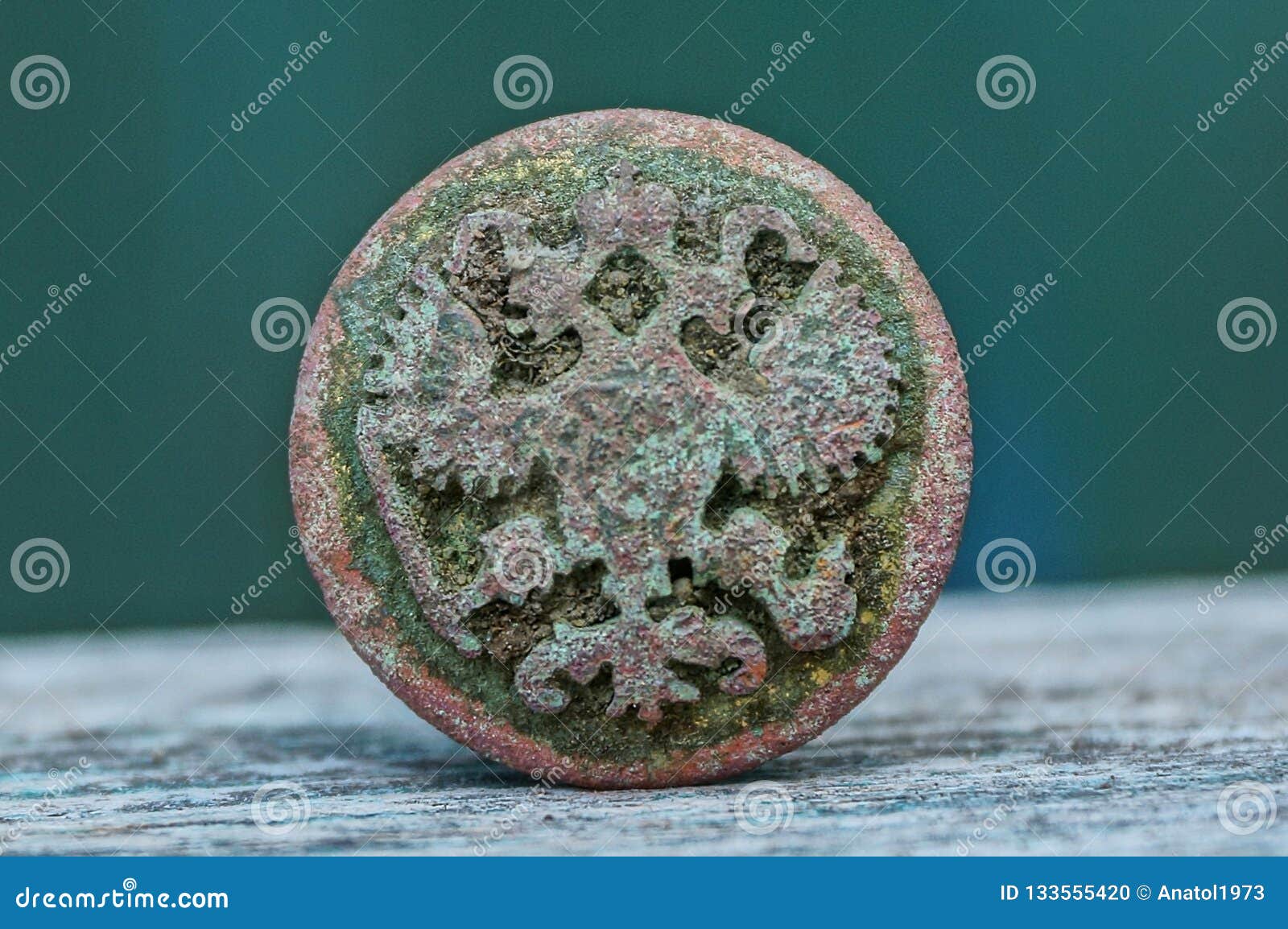 Old Rusty Brown Button with Eagle on Gray Table Stock Photo - Image of ...