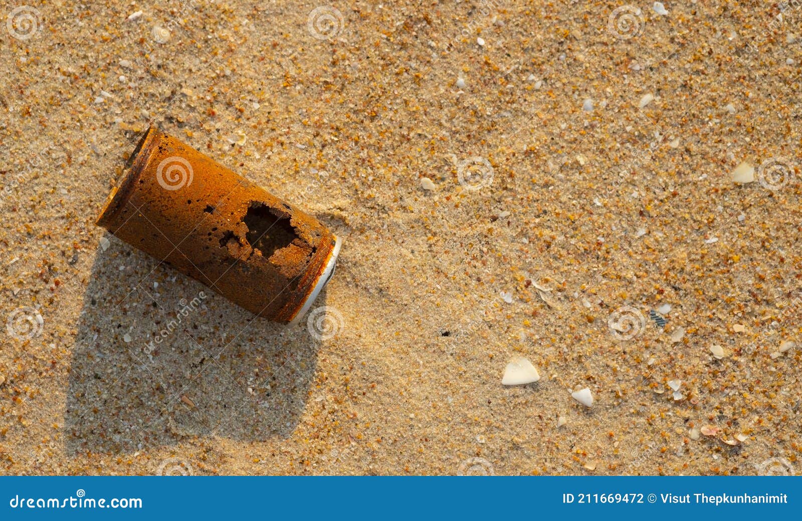 Old Rusty Can Dropped on the Sand Beach, Top View Photo Stock Photo ...