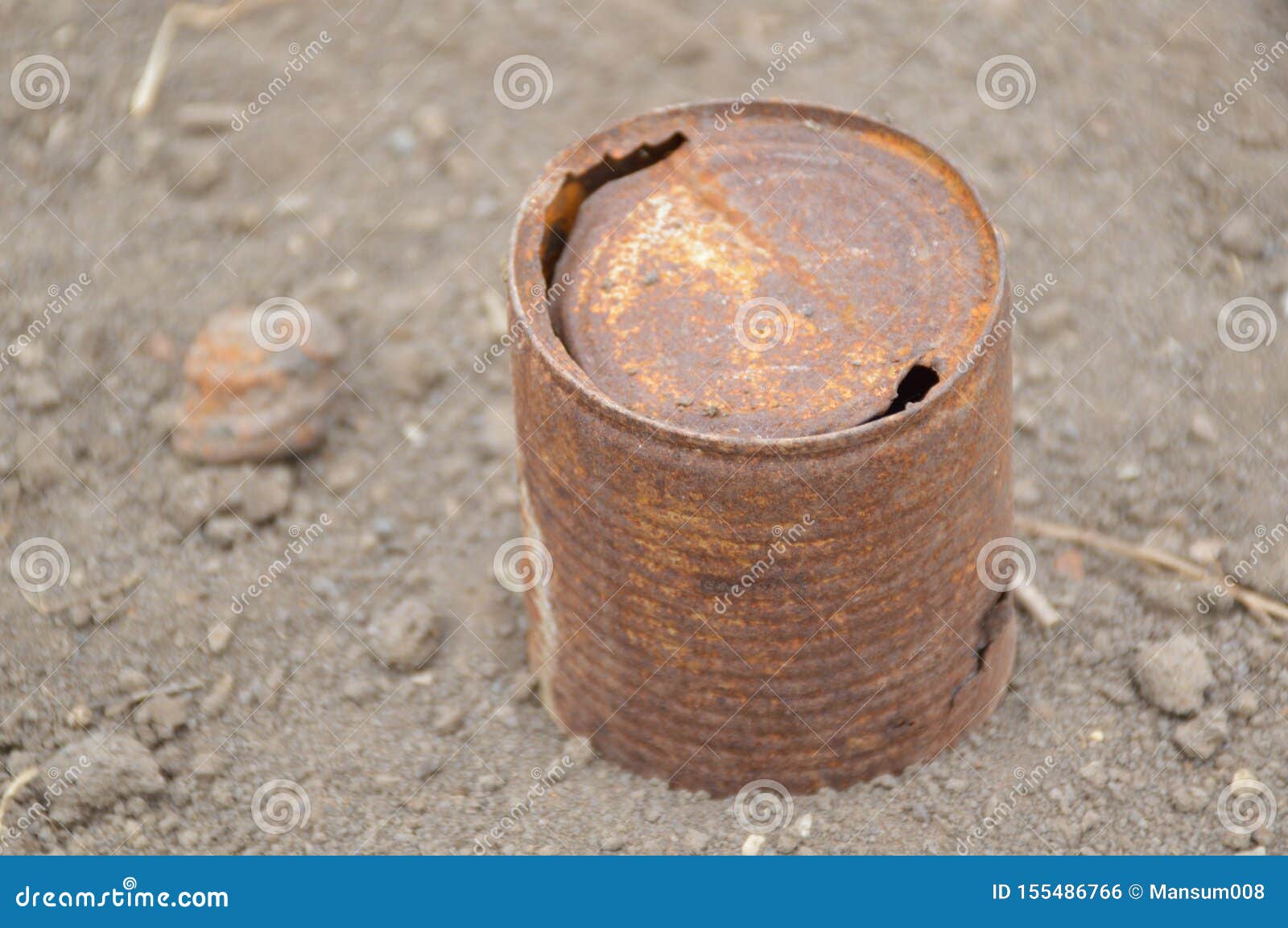 Old Rusty Can on the Ground Stock Photo - Image of brown, rusty: 155486766