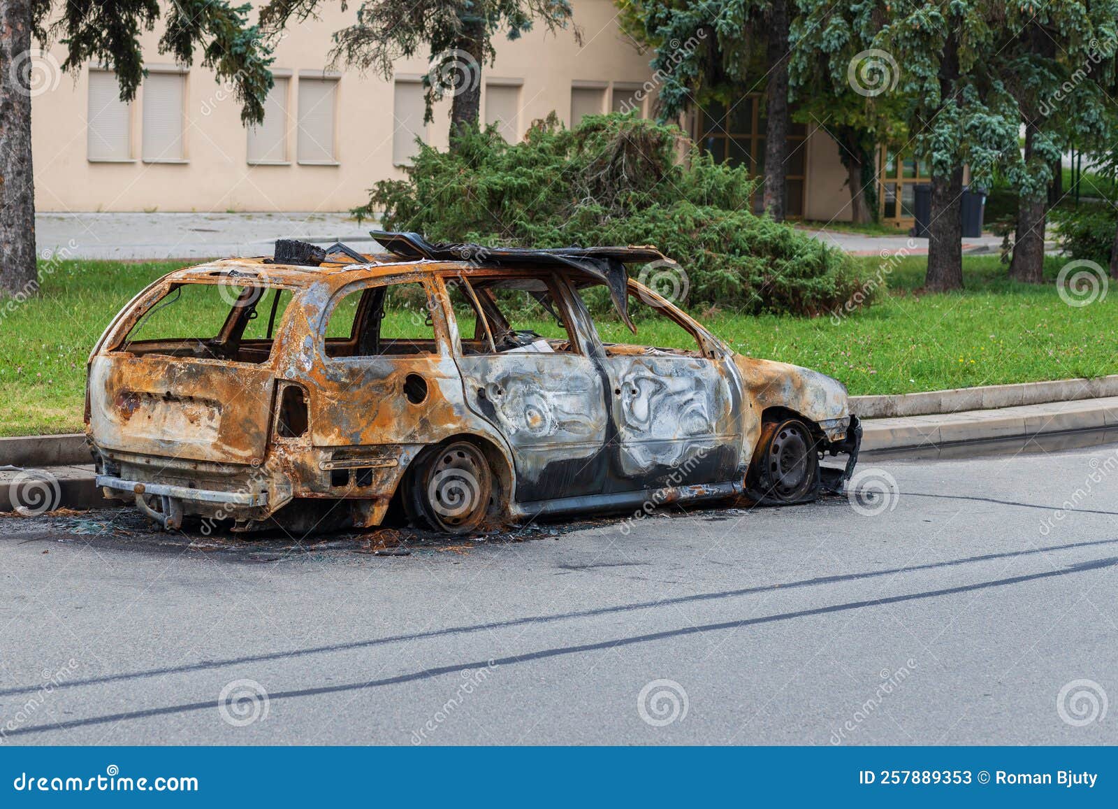 An Old Rusty Car that Burned Down. a Burned-out Car Stands on the Side ...