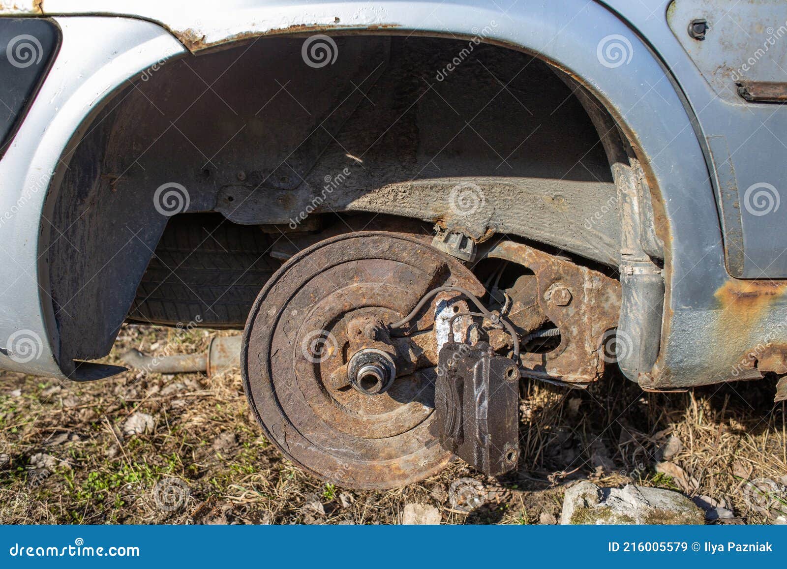 An Old Rusty Car with a Falling Off Wheel. Stock Image - Image of ...