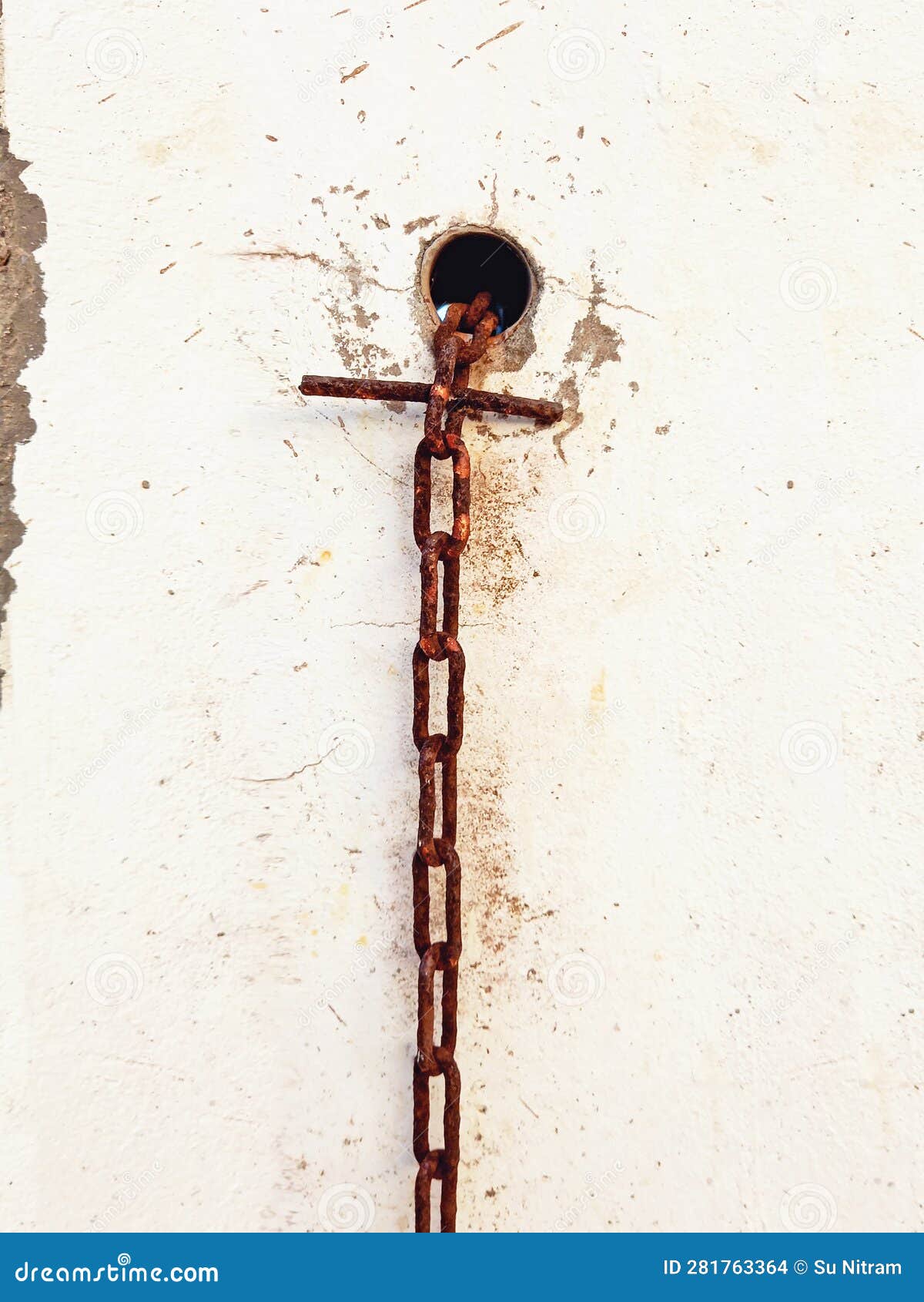 Old Rusty Chain Sticking Out of Hole in Uncorked Cement Wall ...
