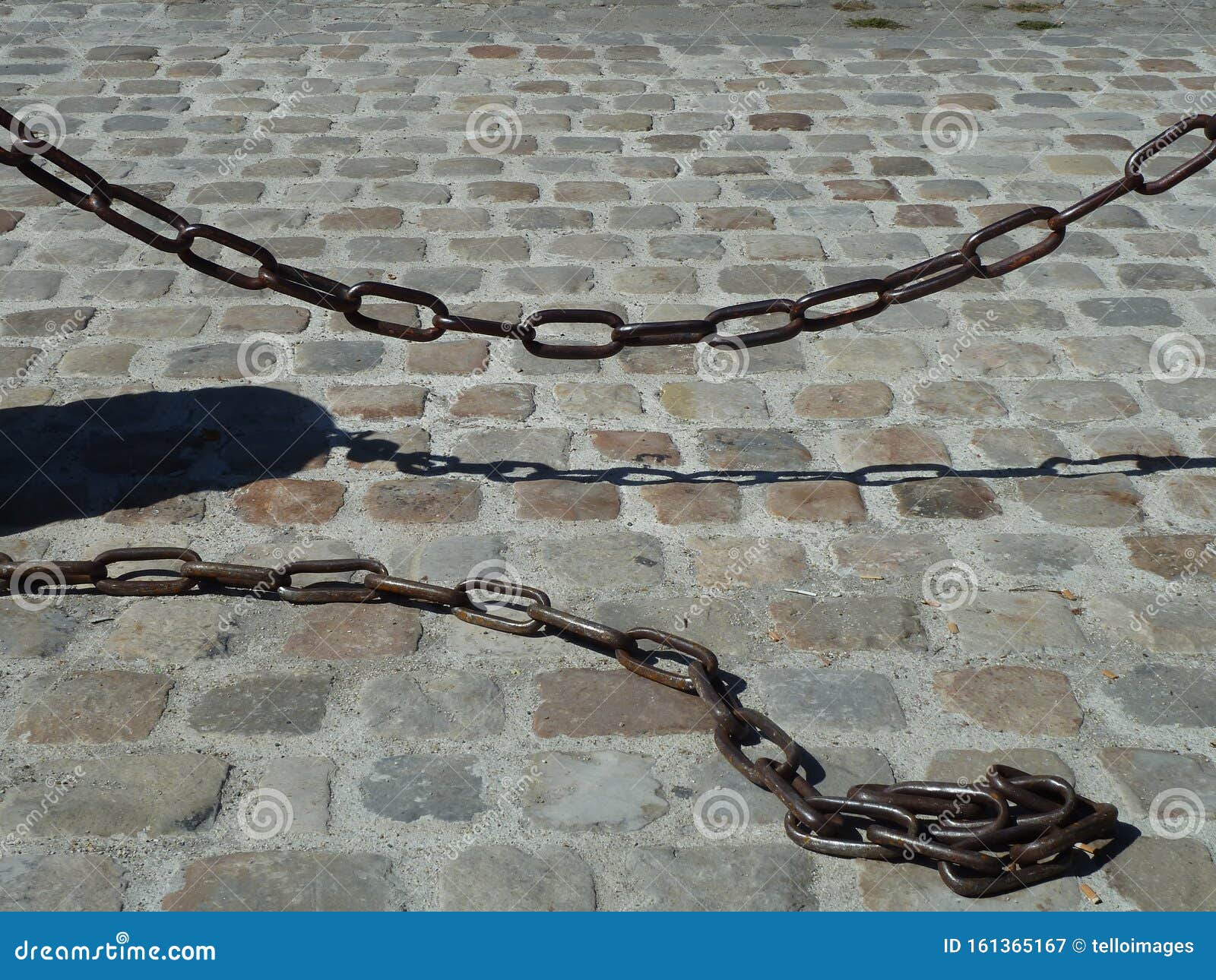 Old Rusty Chains on Cobblestones Stock Image - Image of chain, fetters ...